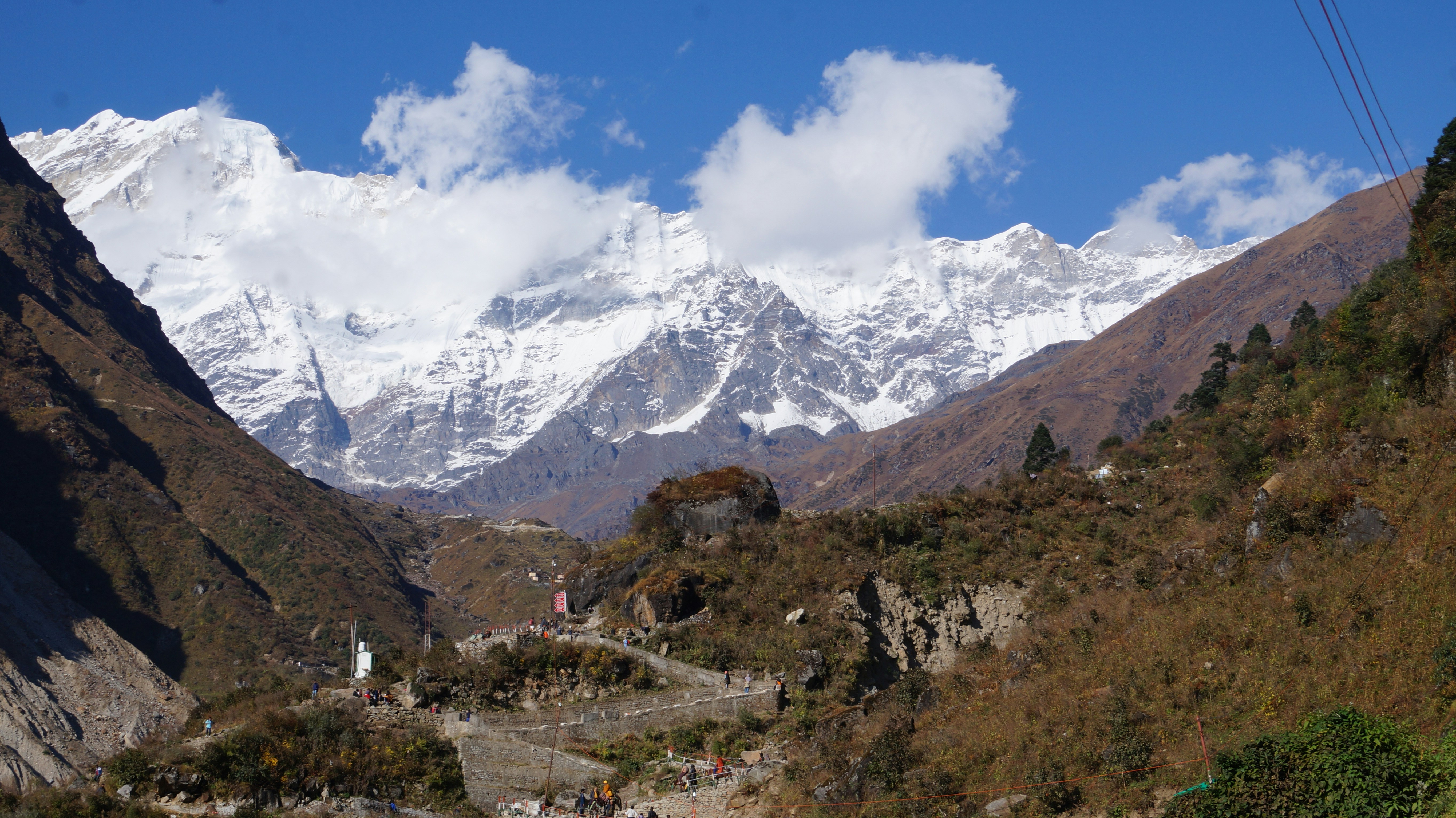 A view of a snowy mountain range from a trail photo – Free Kedarnath ...