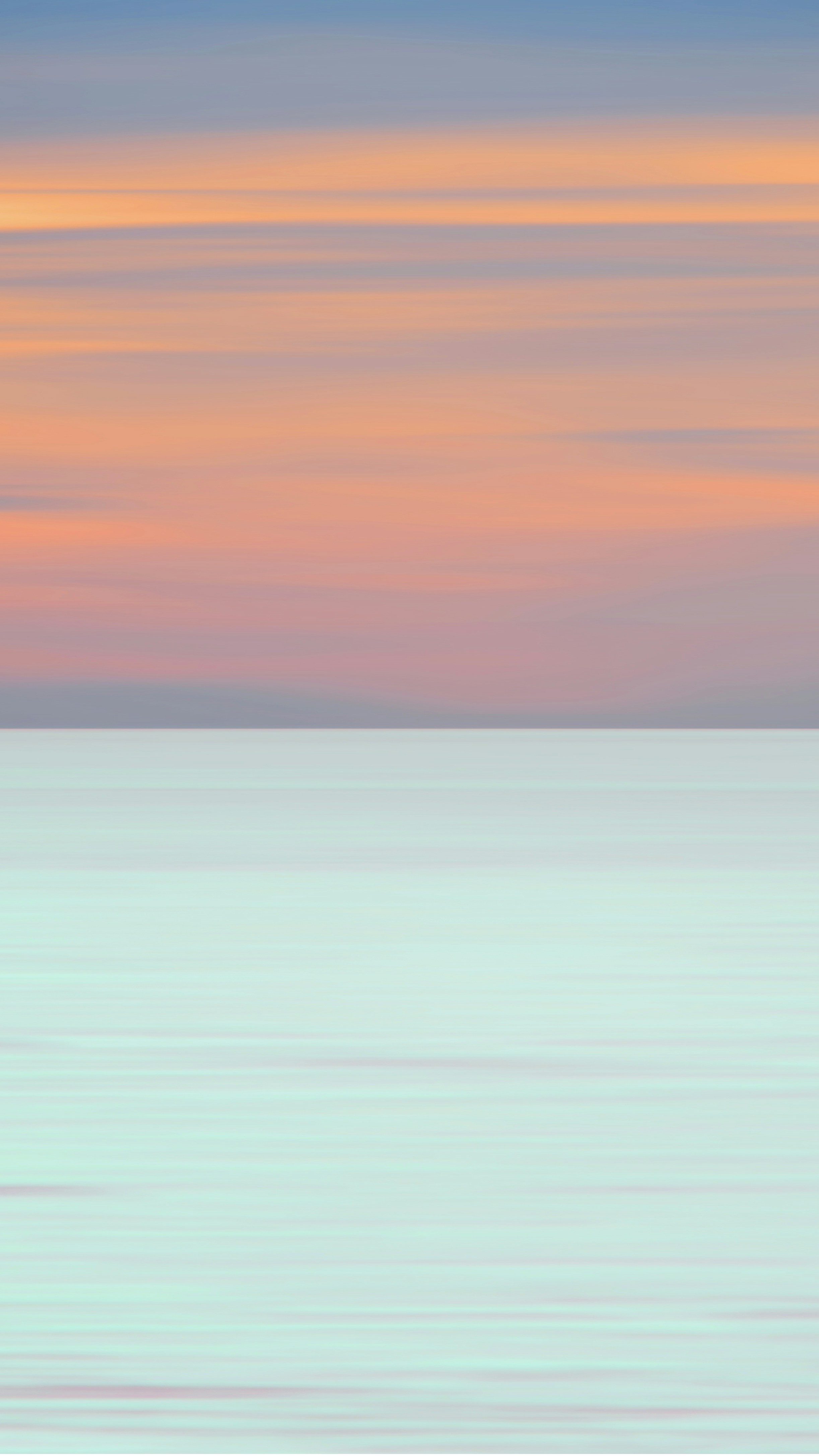 A blurry photo of the ocean at sunset photo – Free Indonesia Image on ...