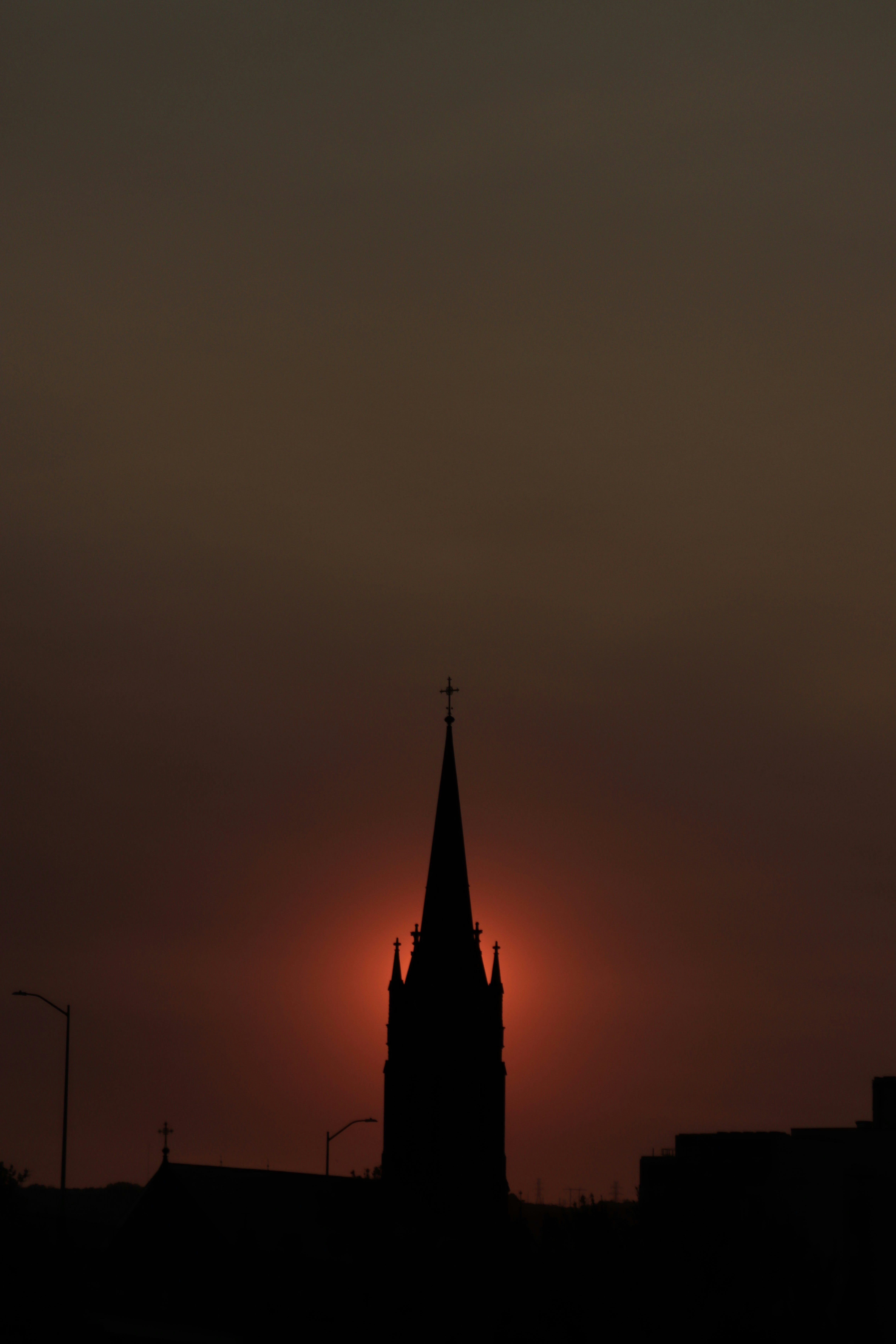 The sun is setting behind a church steeple photo – Free Wilkes-barre ...
