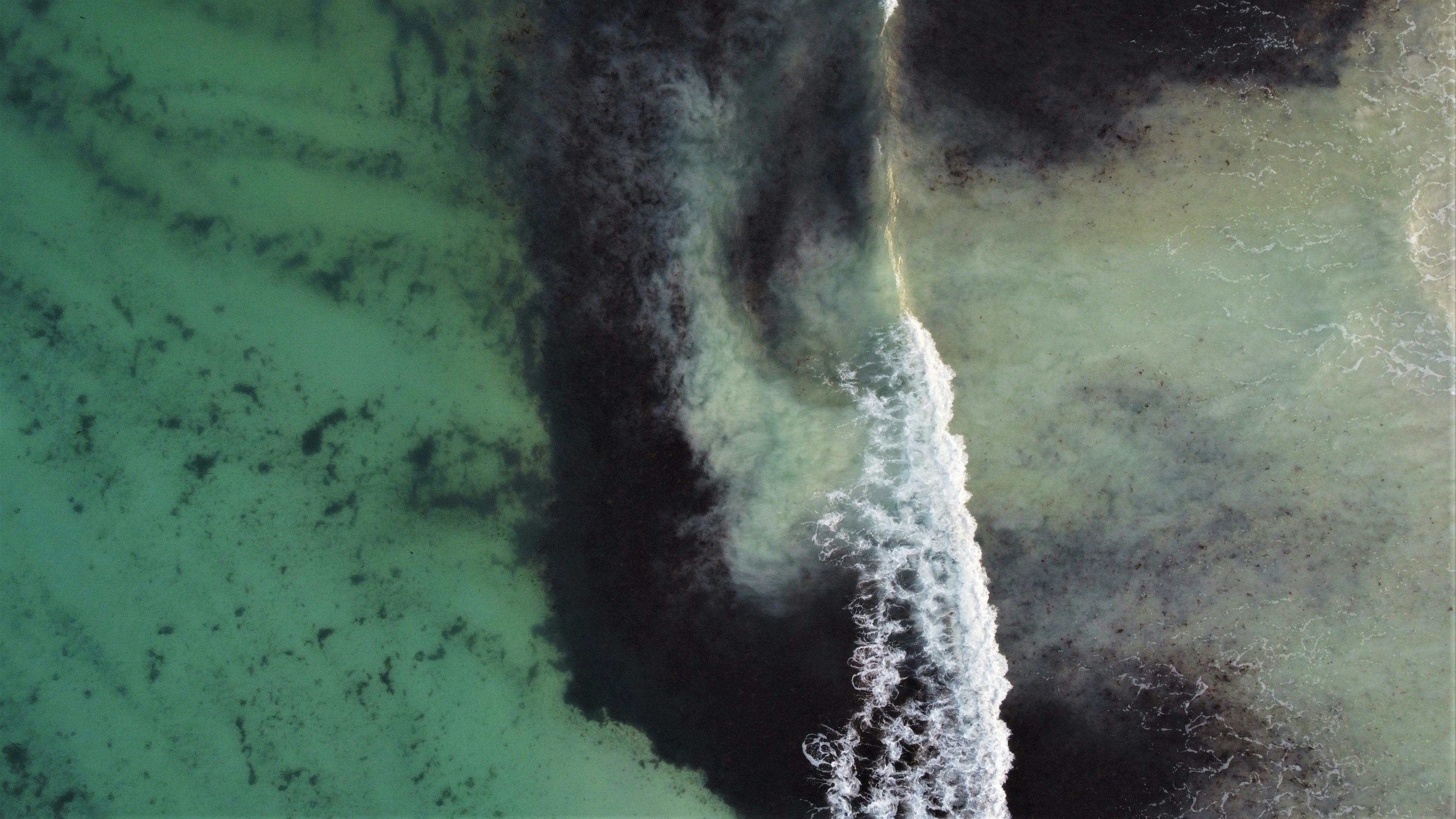 Dark Channel Through Turquoise Waters: Foam-Fringed Boundary from Above