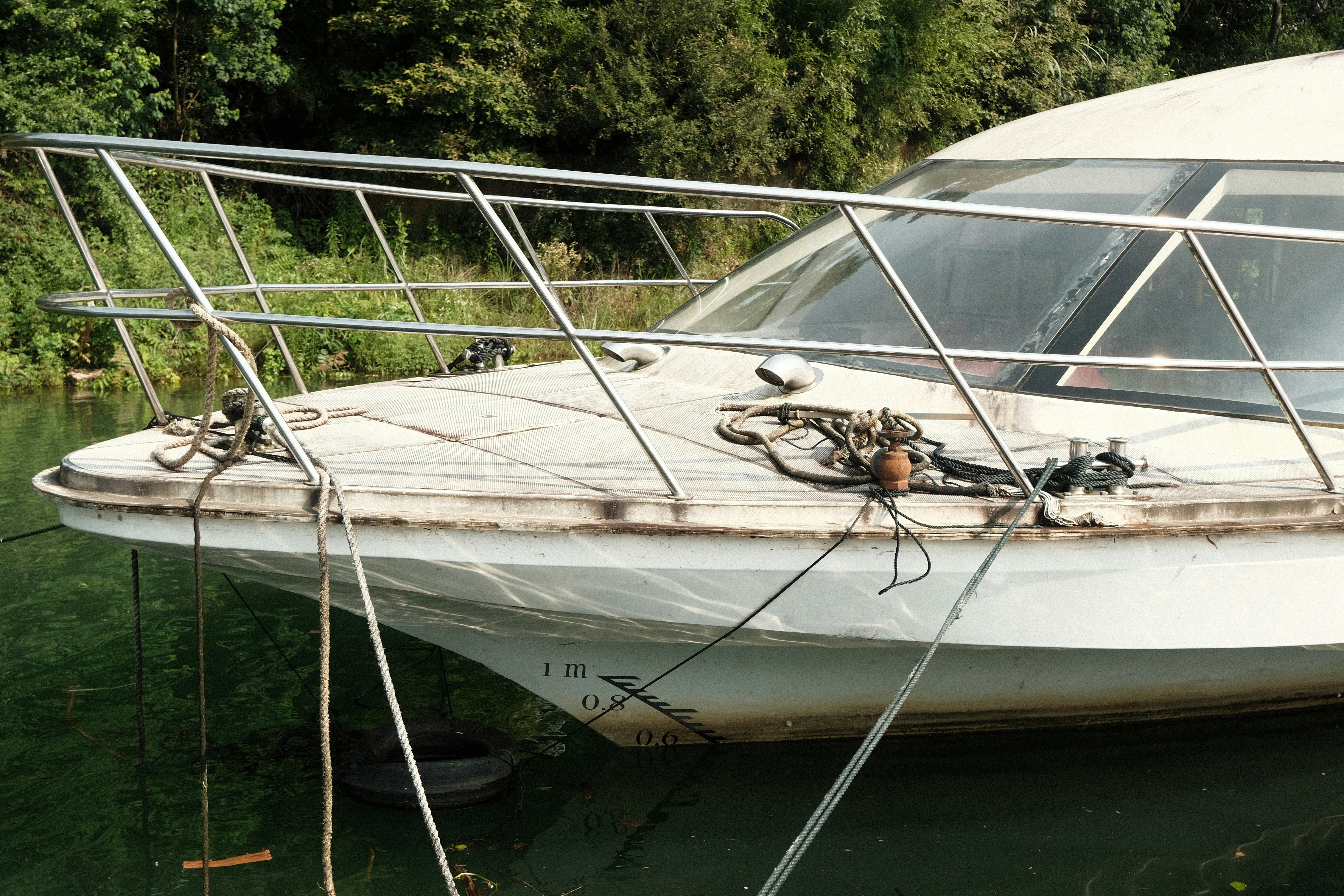 Bow Framed by Ropes and Rails: A Weathered Vessel at Rest