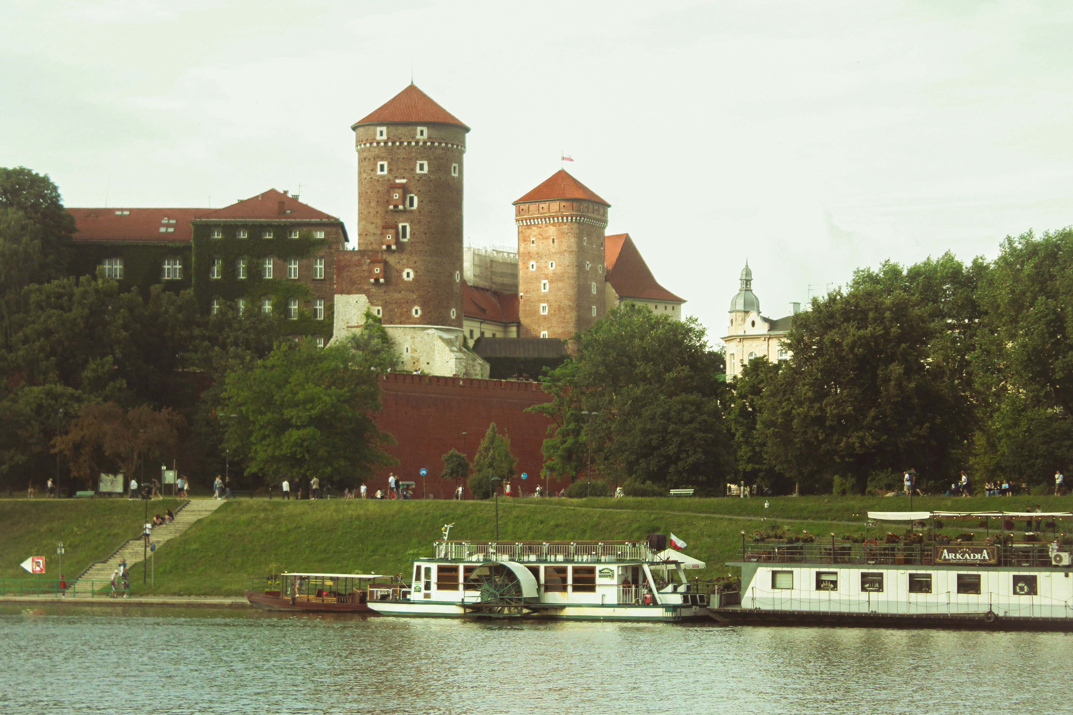 Two boats are docked in front of a castle photo – Free Castle Image on ...