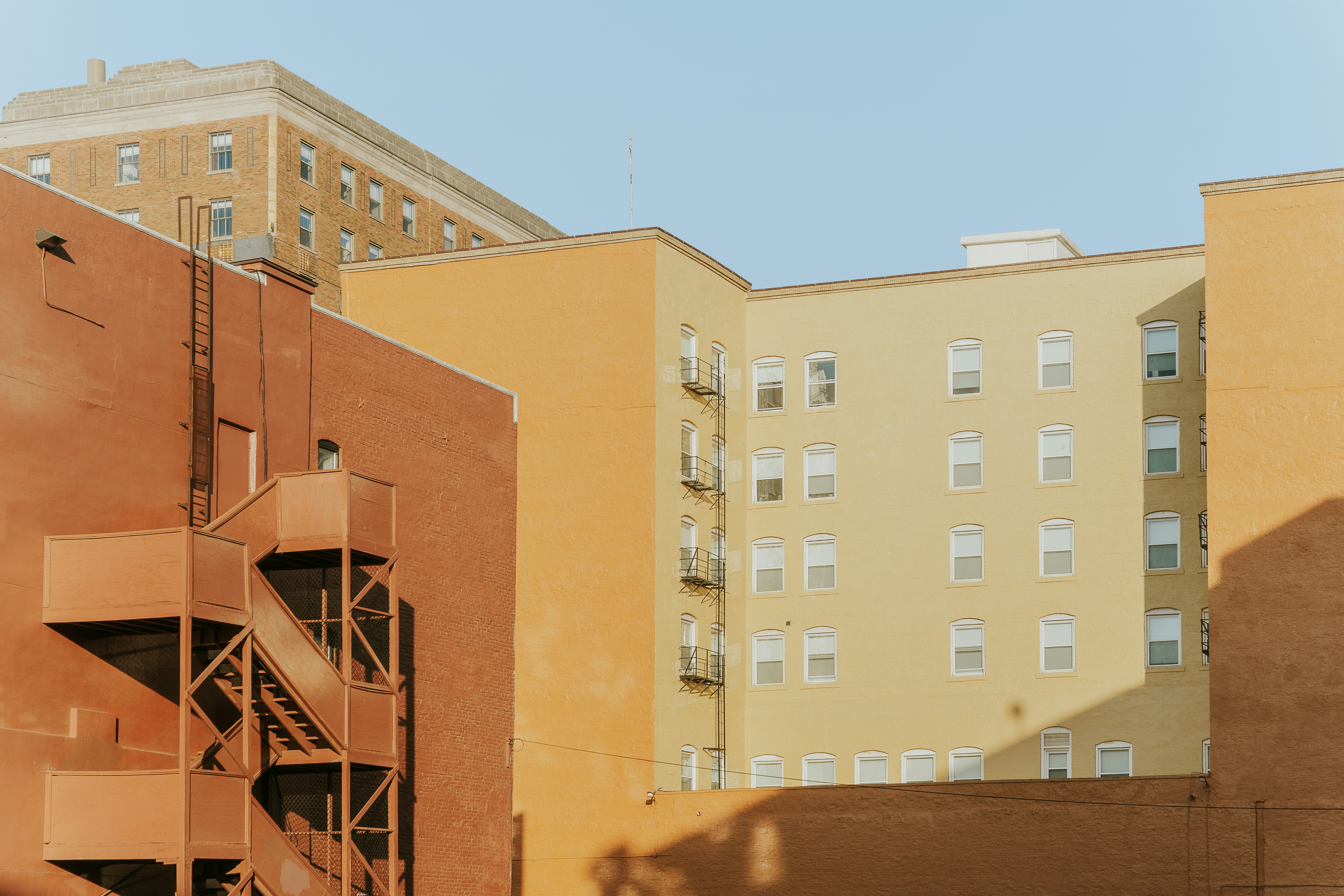 A building with a fire escape in front of it photo – Free Building ...