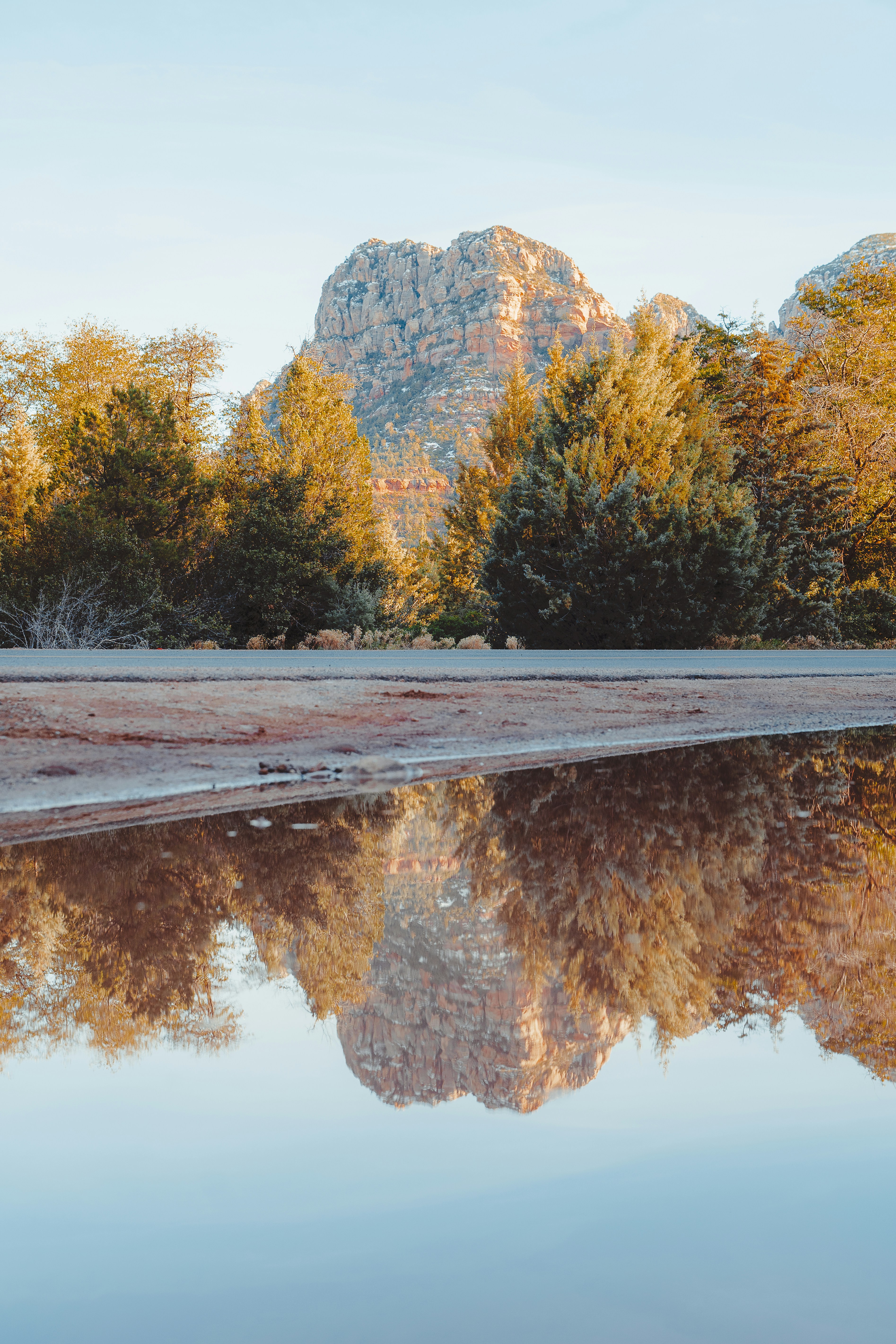 Echoes of the Stone Peak Across a Serene Reflective Pool