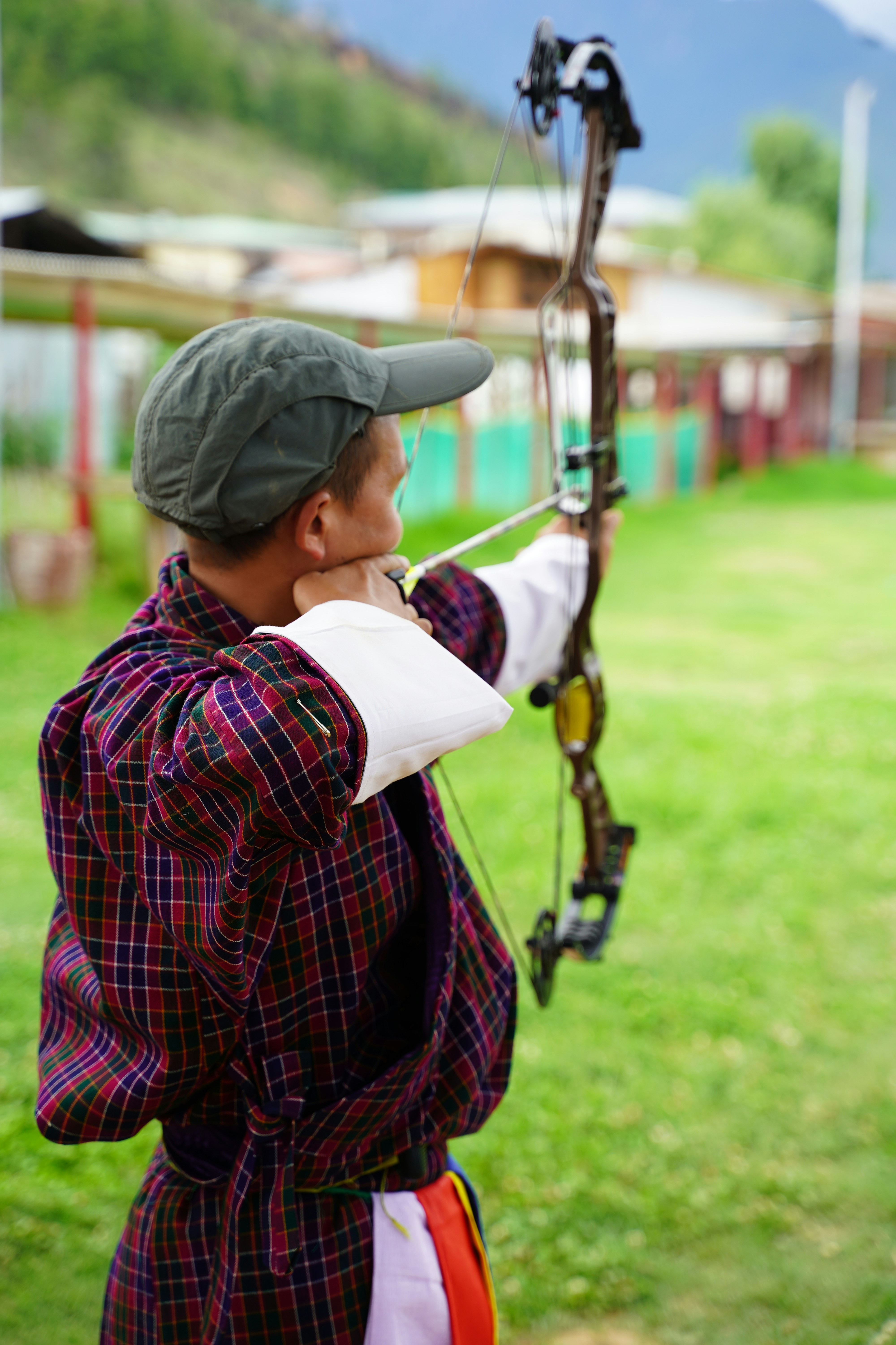 A man holding a bow and arrow in his hand photo – Free Woman Image on ...