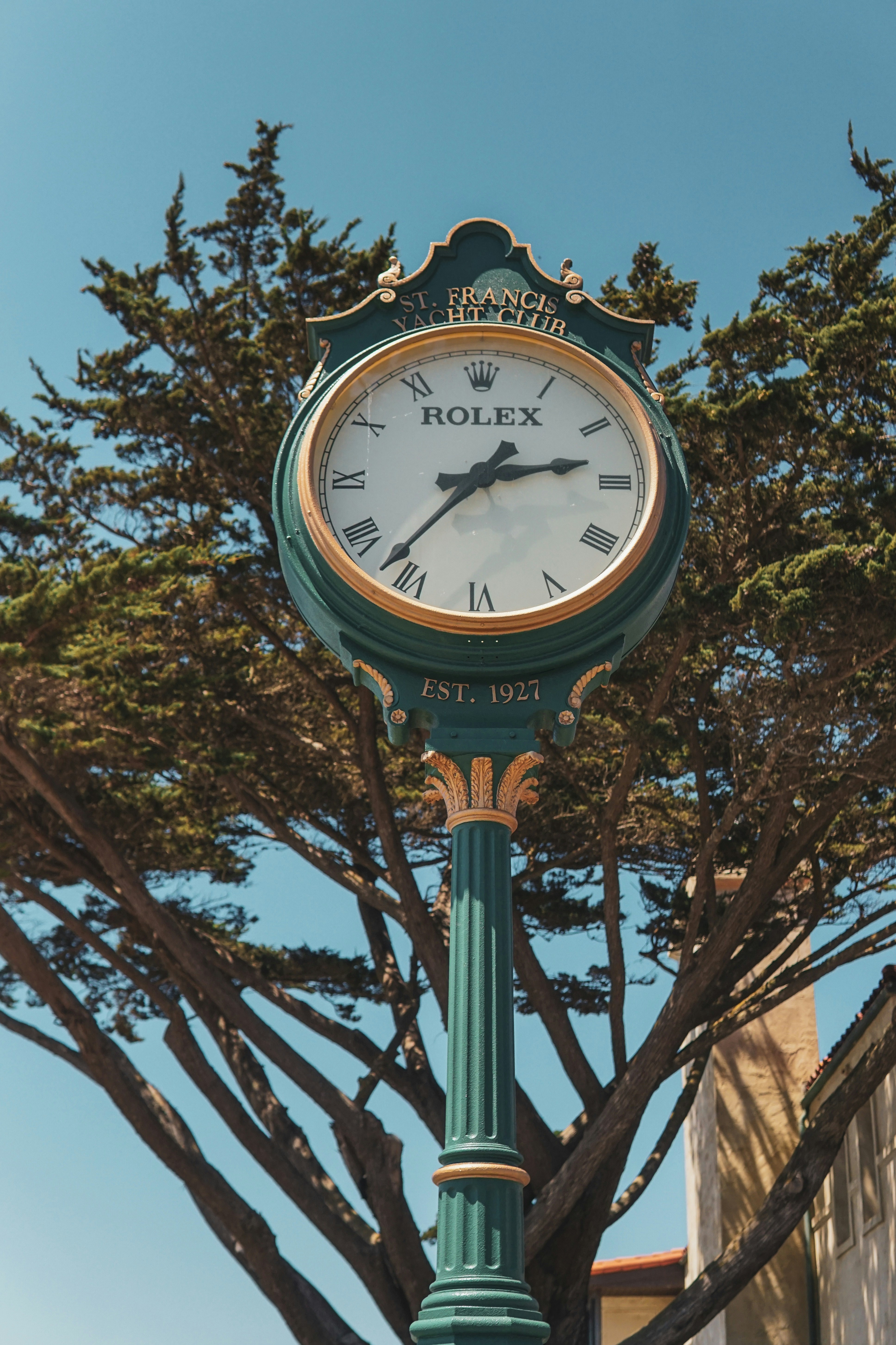 A green pole with a clock on top of it photo – Free San francisco Image ...