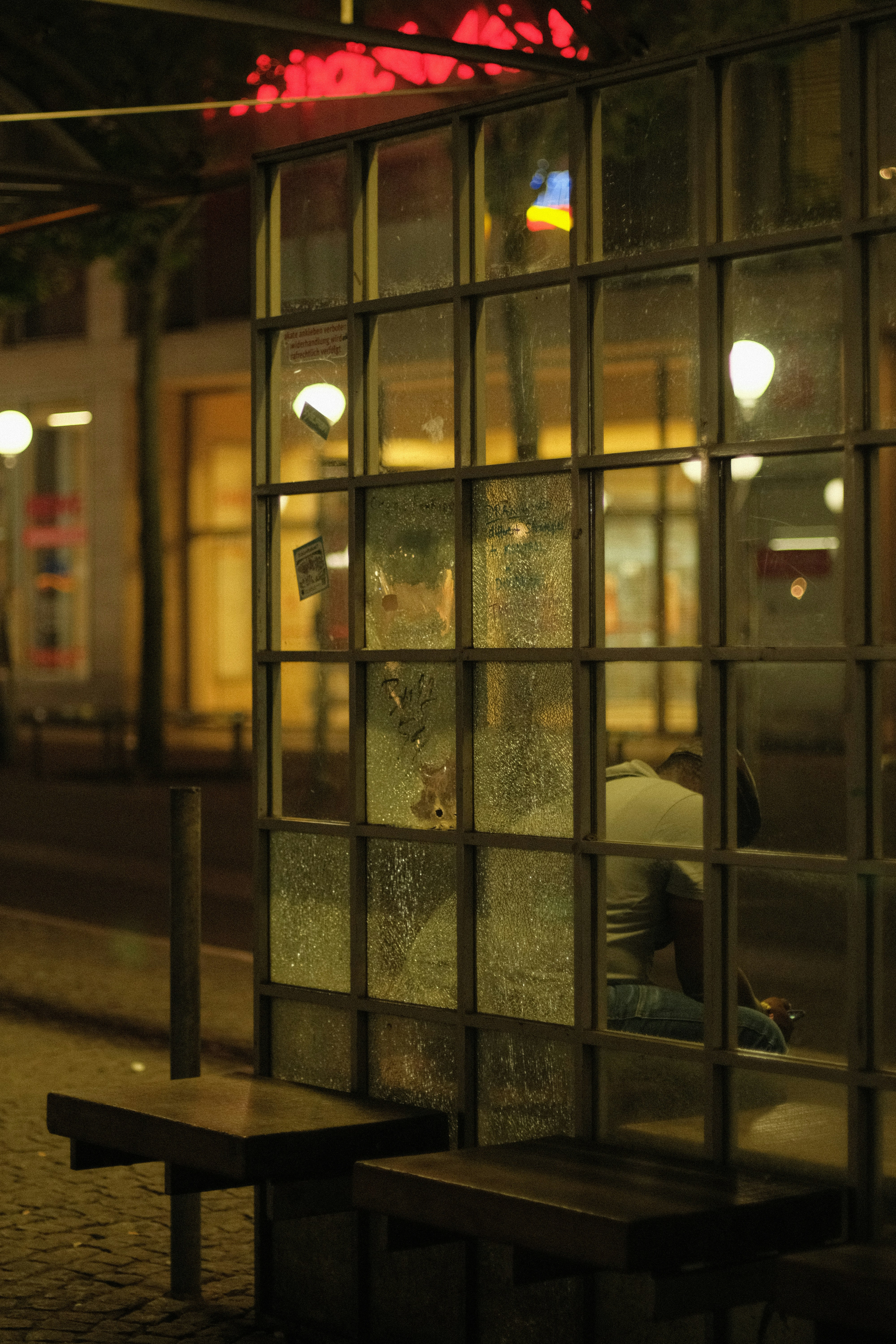 Being unable to see the face of the man makes you curious what he feels. The moody lights could either portray a comforting mood or a mood of sadness. Leaves a lot of opportunities for interpretation.