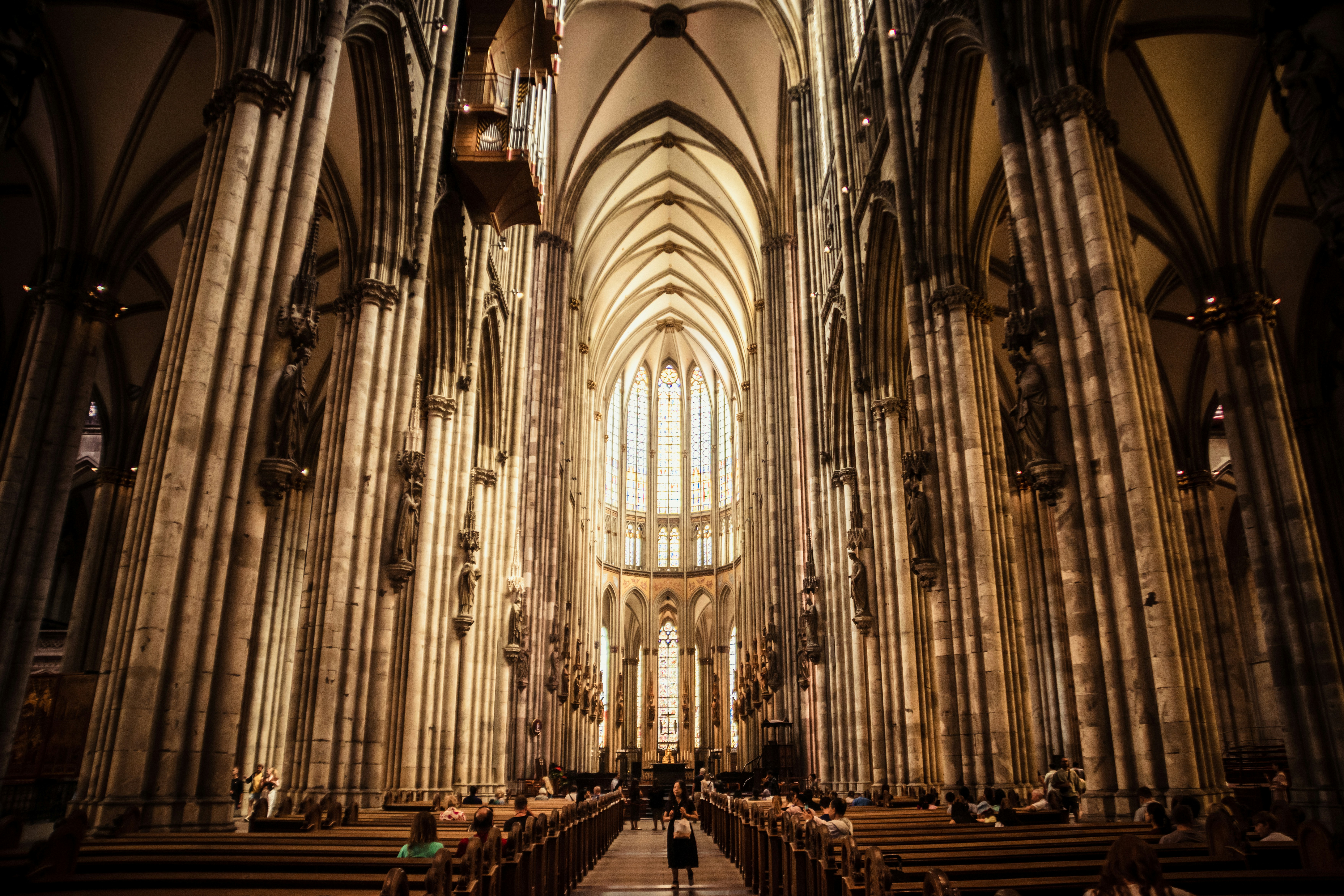 A large cathedral filled with lots of pews photo – Free Desktop ...