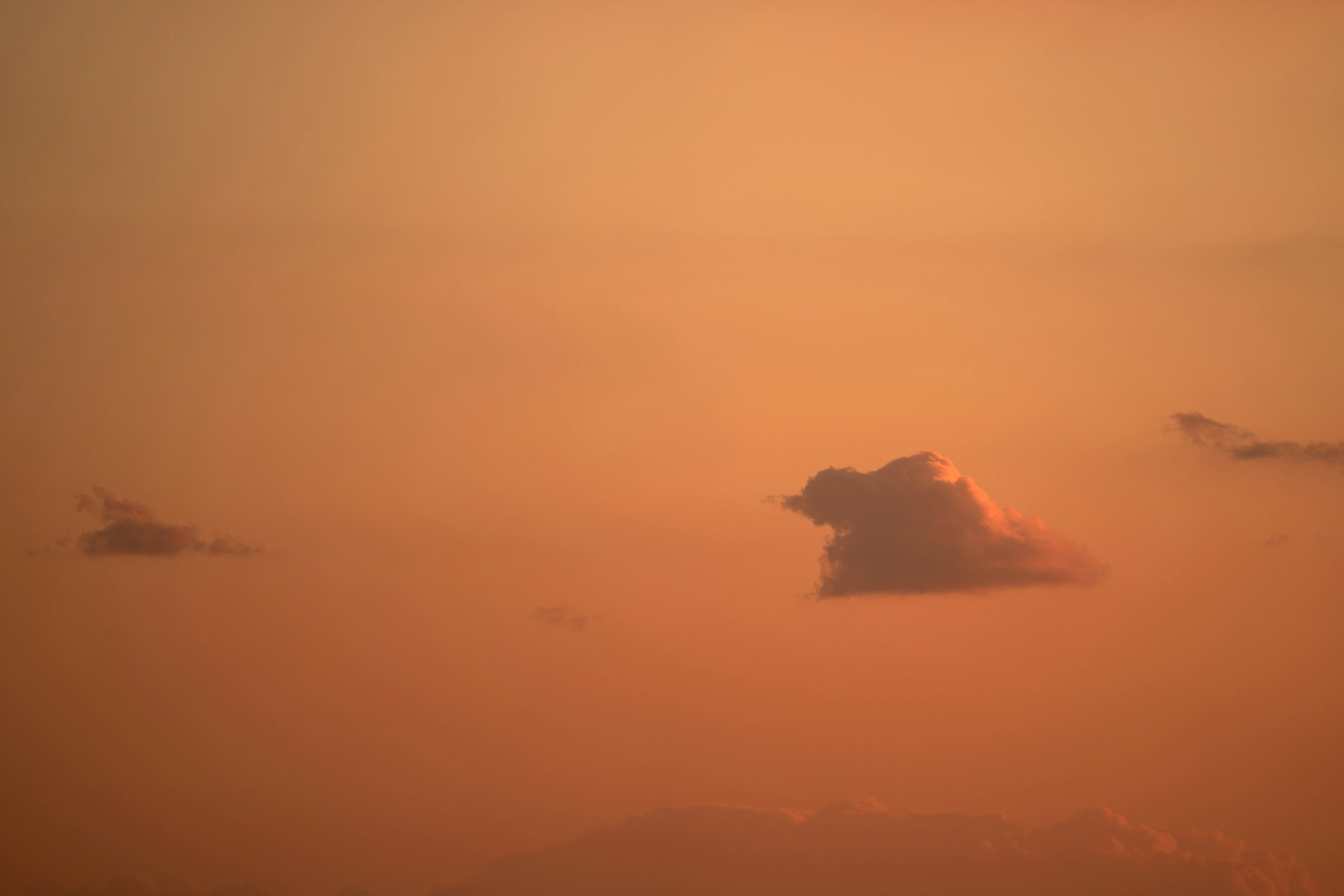 Ember Cloud Over a Quiet Horizon