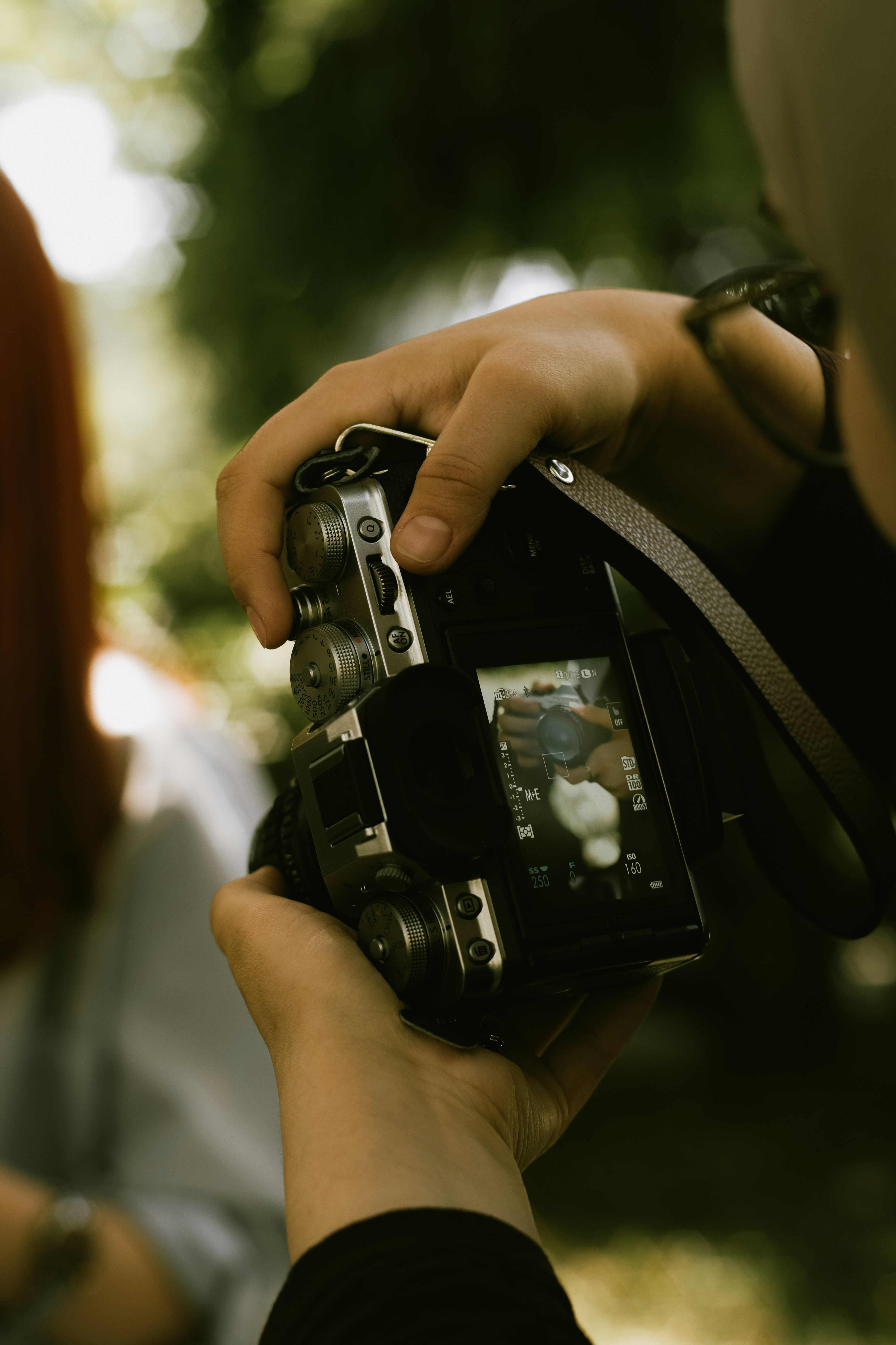 A person holding a camera up to take a picture photo – Free Image on ...