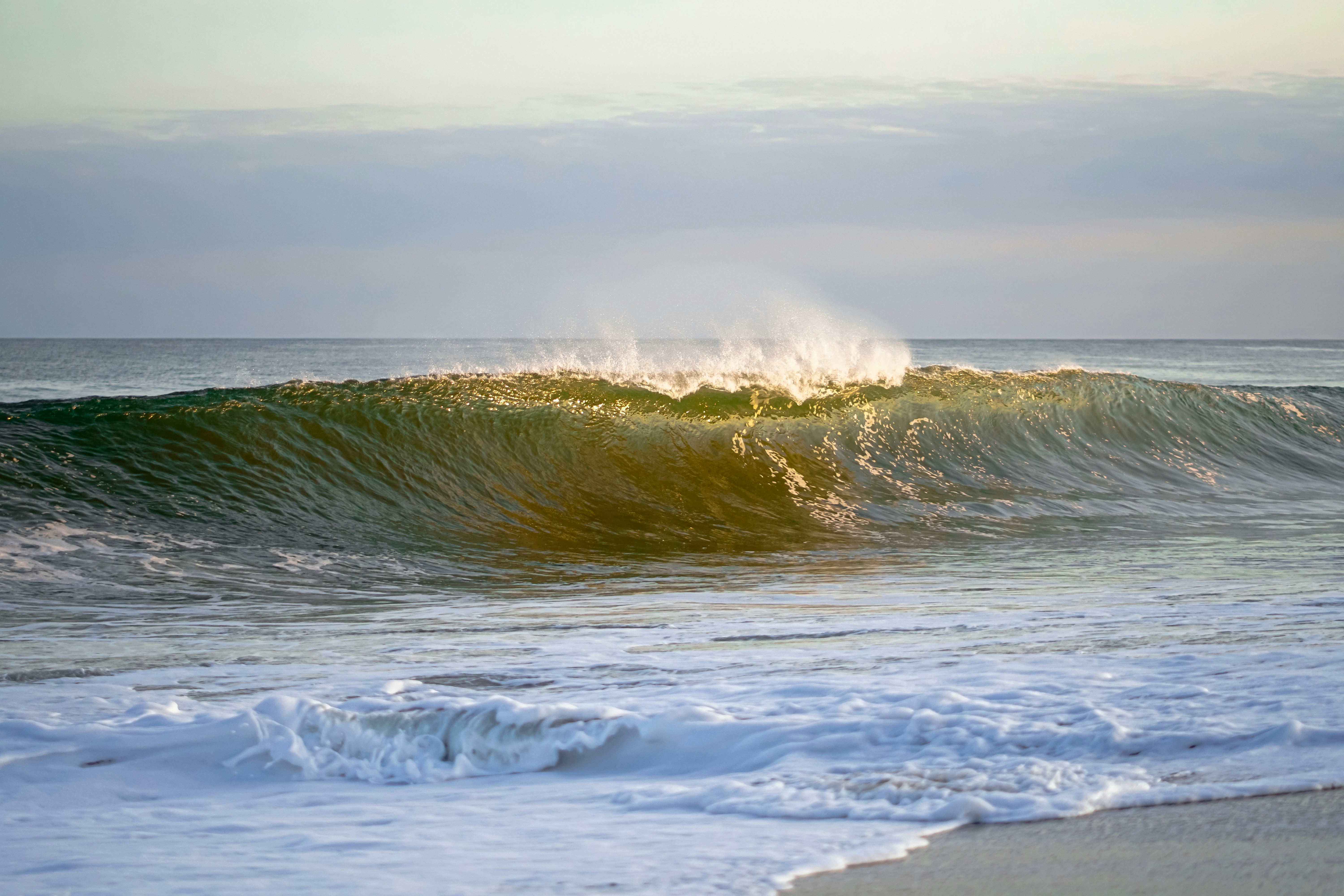 A large wave is coming in to the shore photo – Free Uruguay Image on ...