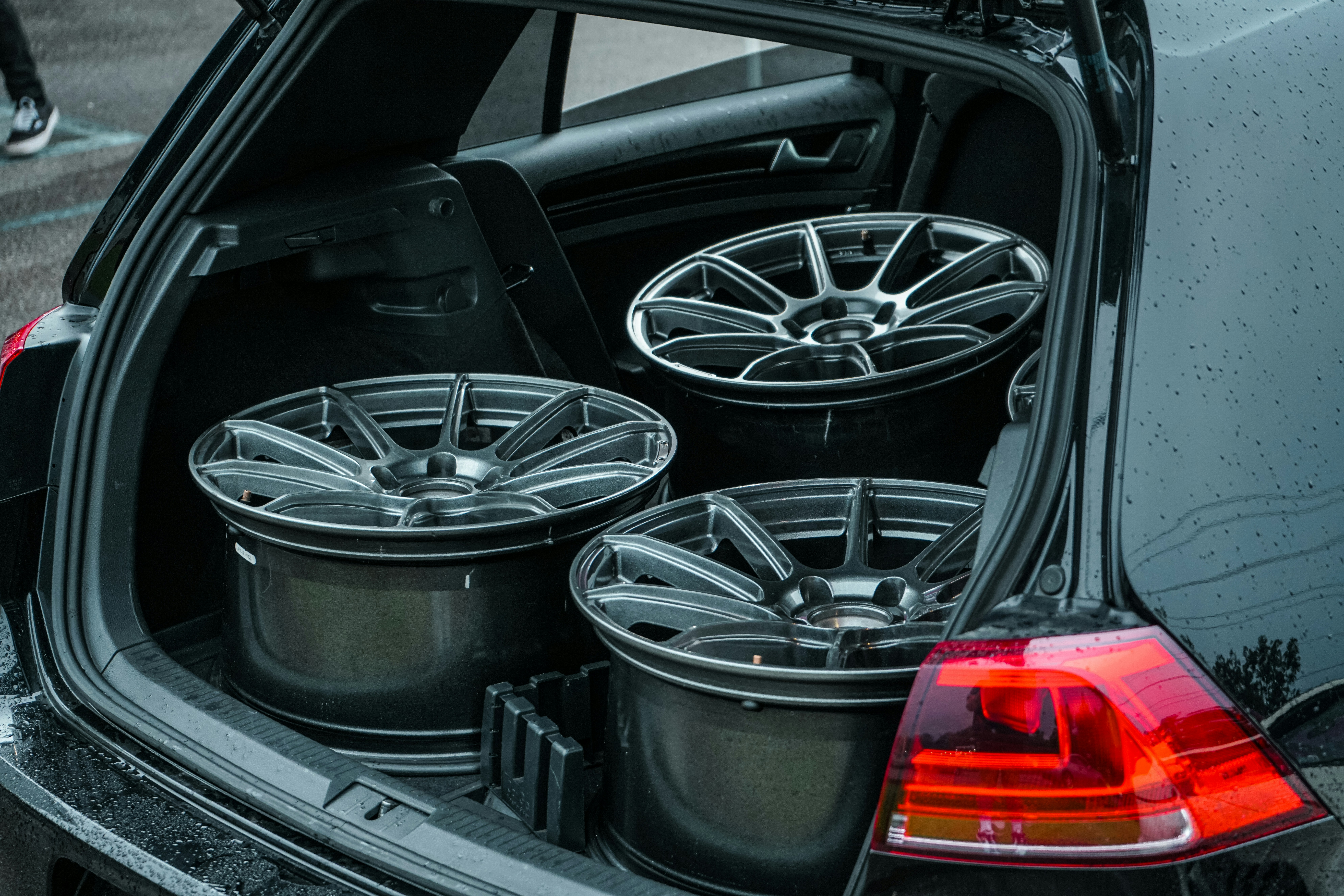 The back of a car with a bunch of wheels in it photo – Free Image on ...