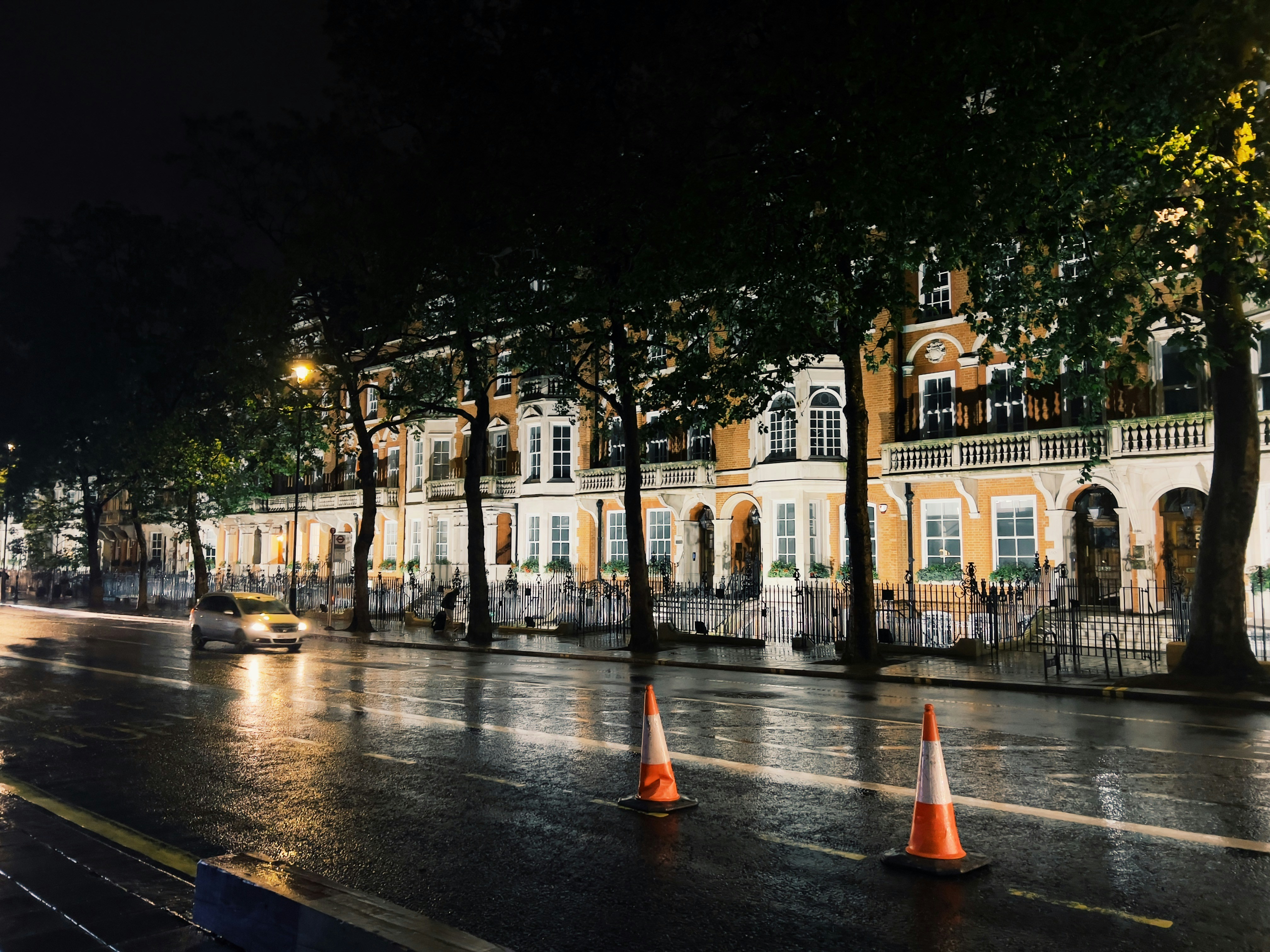 Georgian Row at Night: Rain, Reflections, and Cones