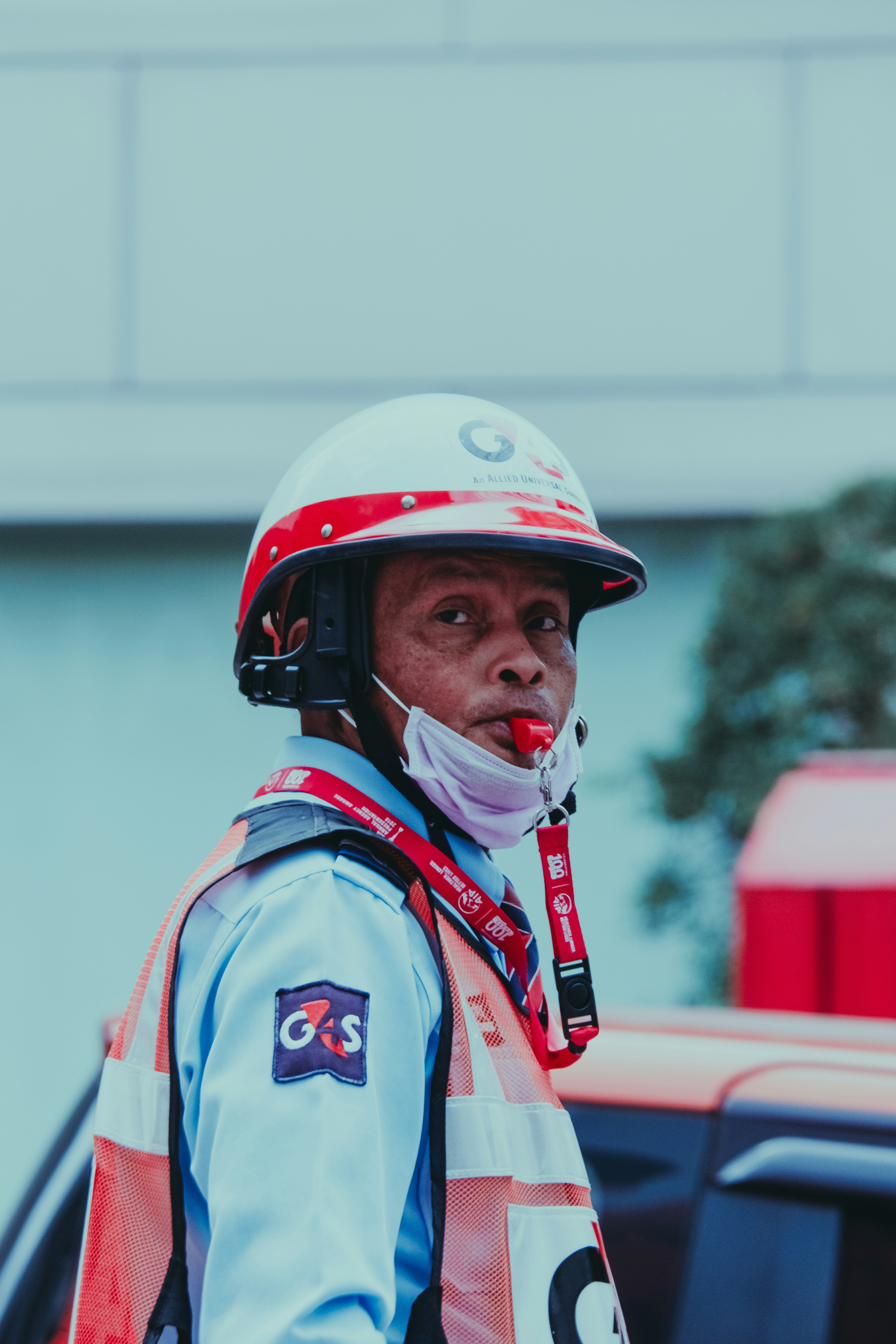 Helmeted Responder: Focused Gaze Under Red-Rimmed Mask