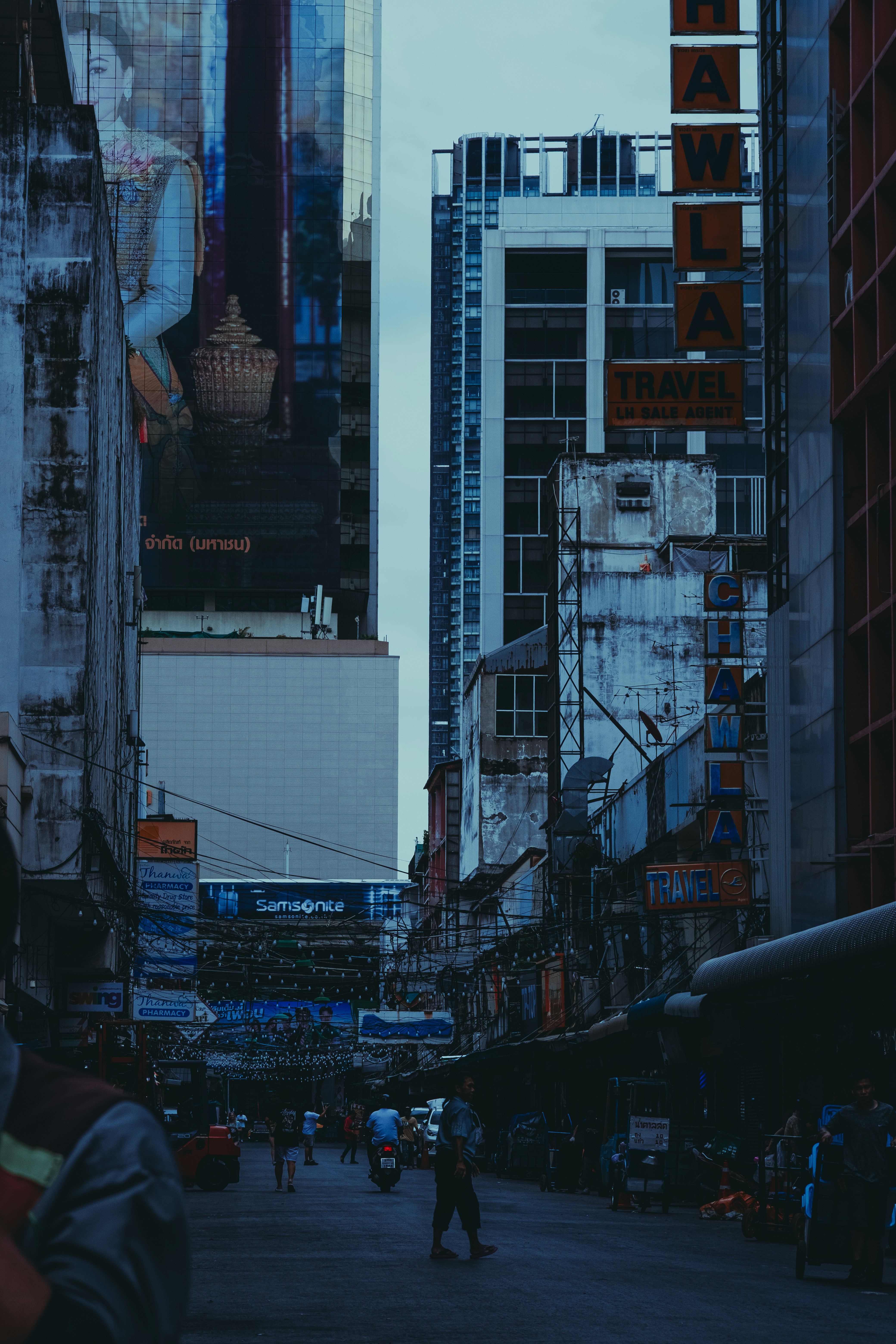 Blue Hour Canyon: Neon Signs Framing a Narrow City Street