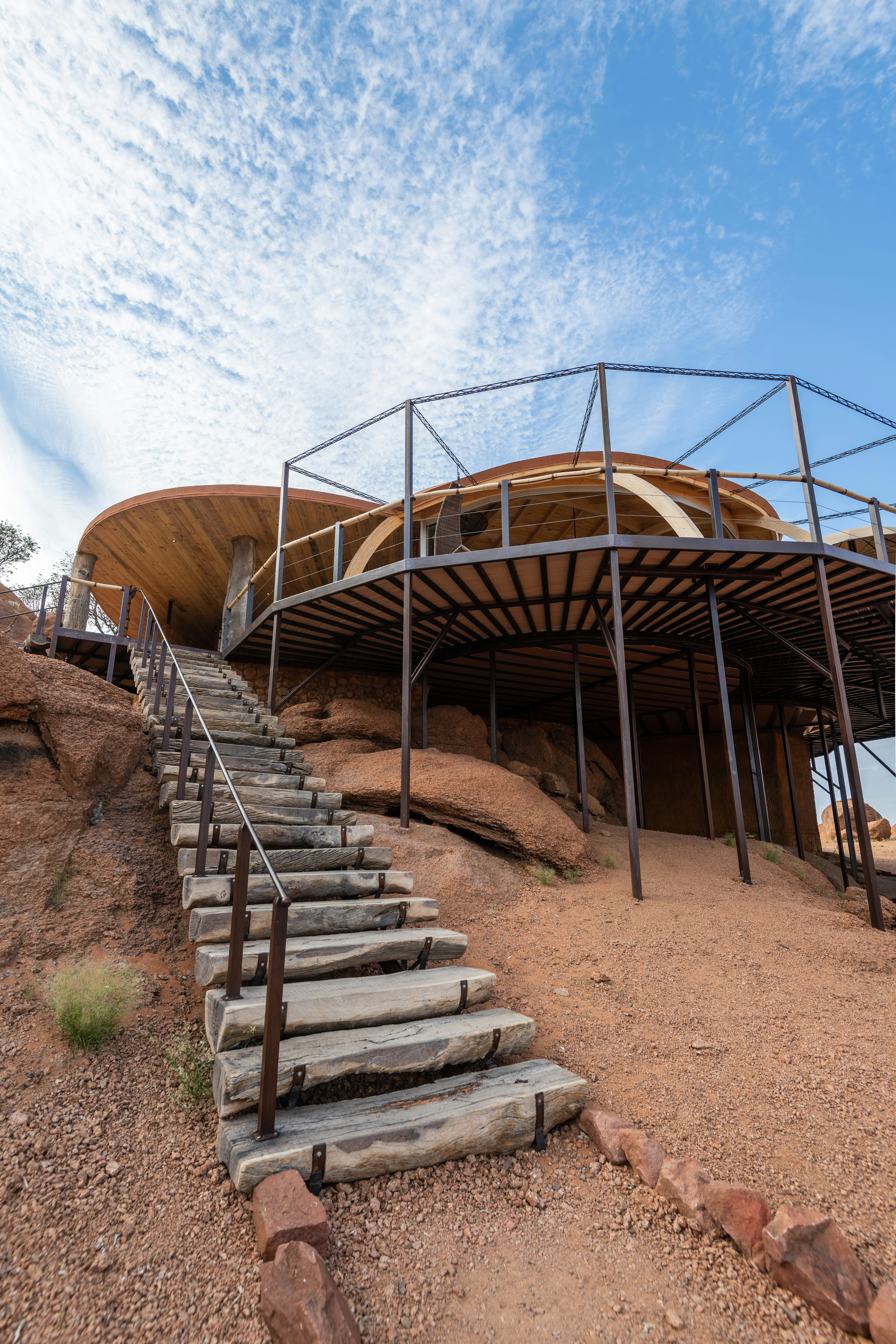 A set of stairs leading up to a structure on top of a hill photo – Free ...