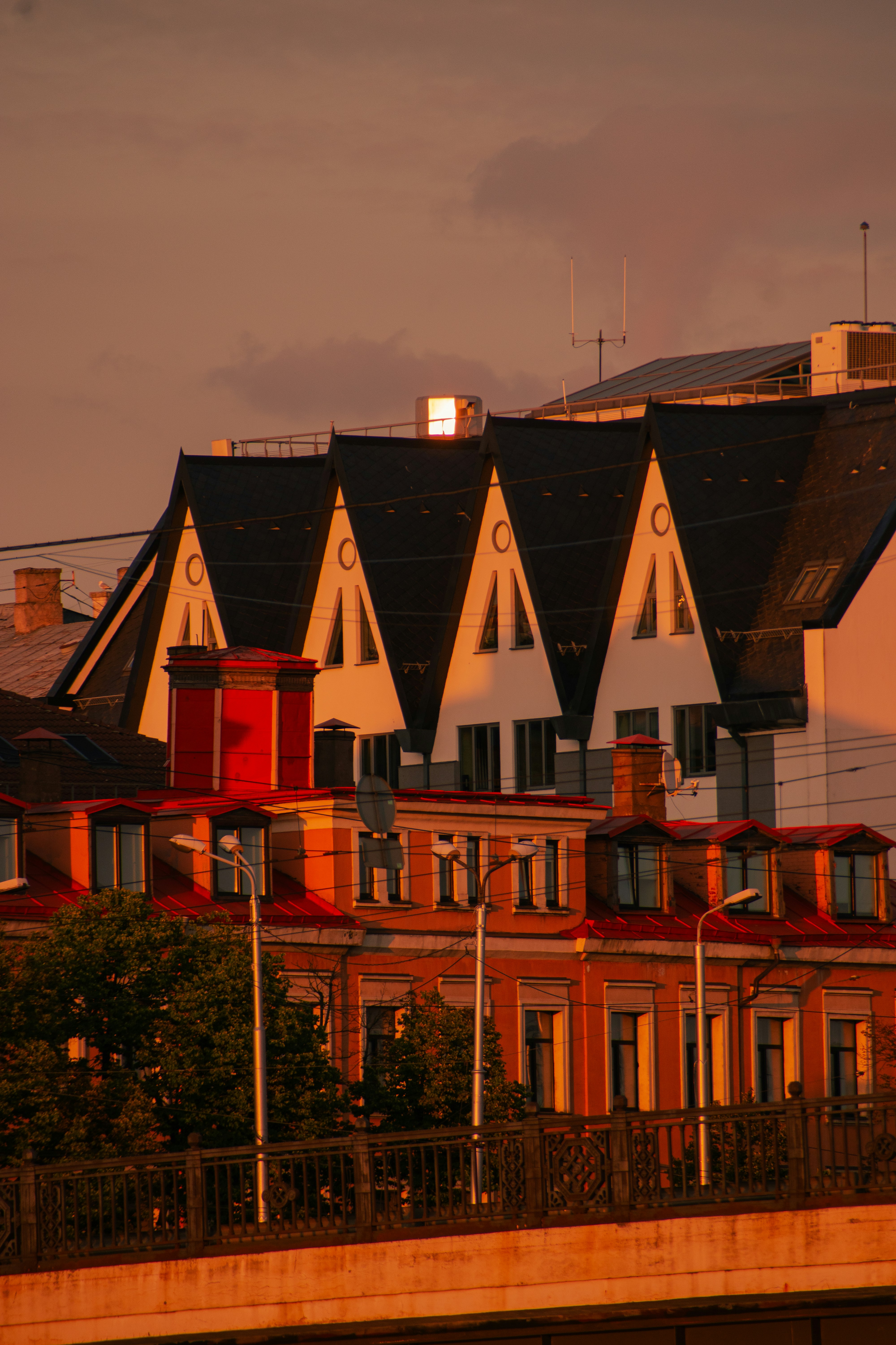 Golden Hour Triangular Gables Over a Brick Skyline