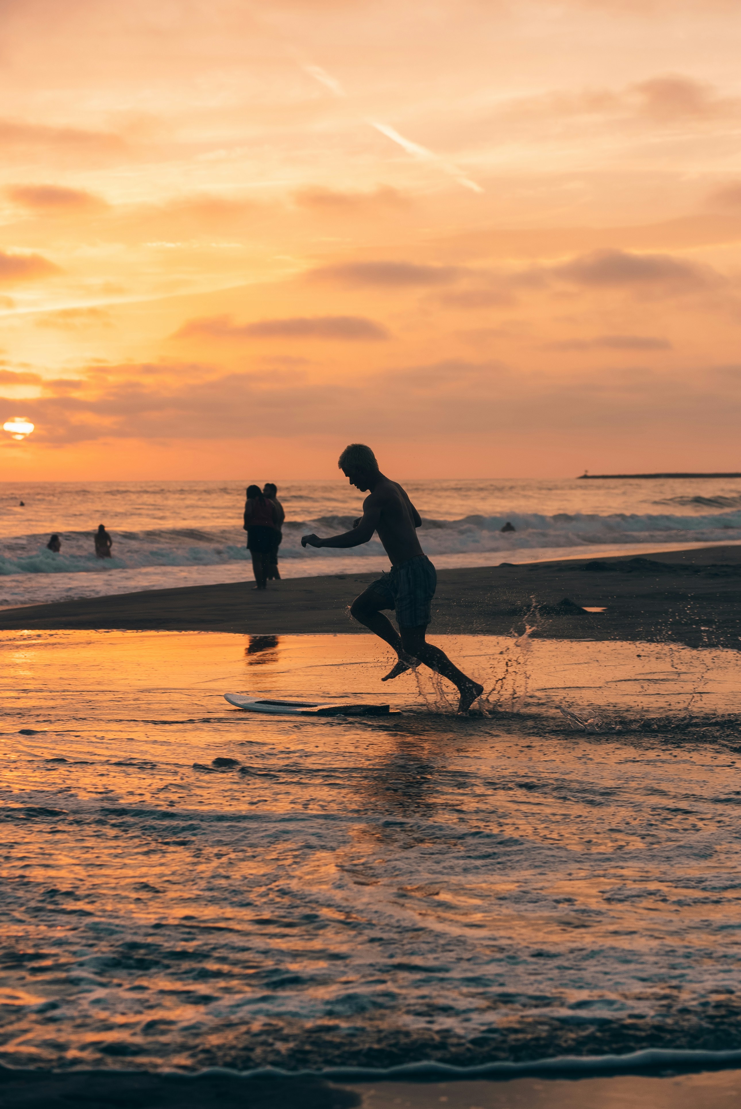 A man riding a surfboard on top of a wave photo – Free Oceanside Image ...