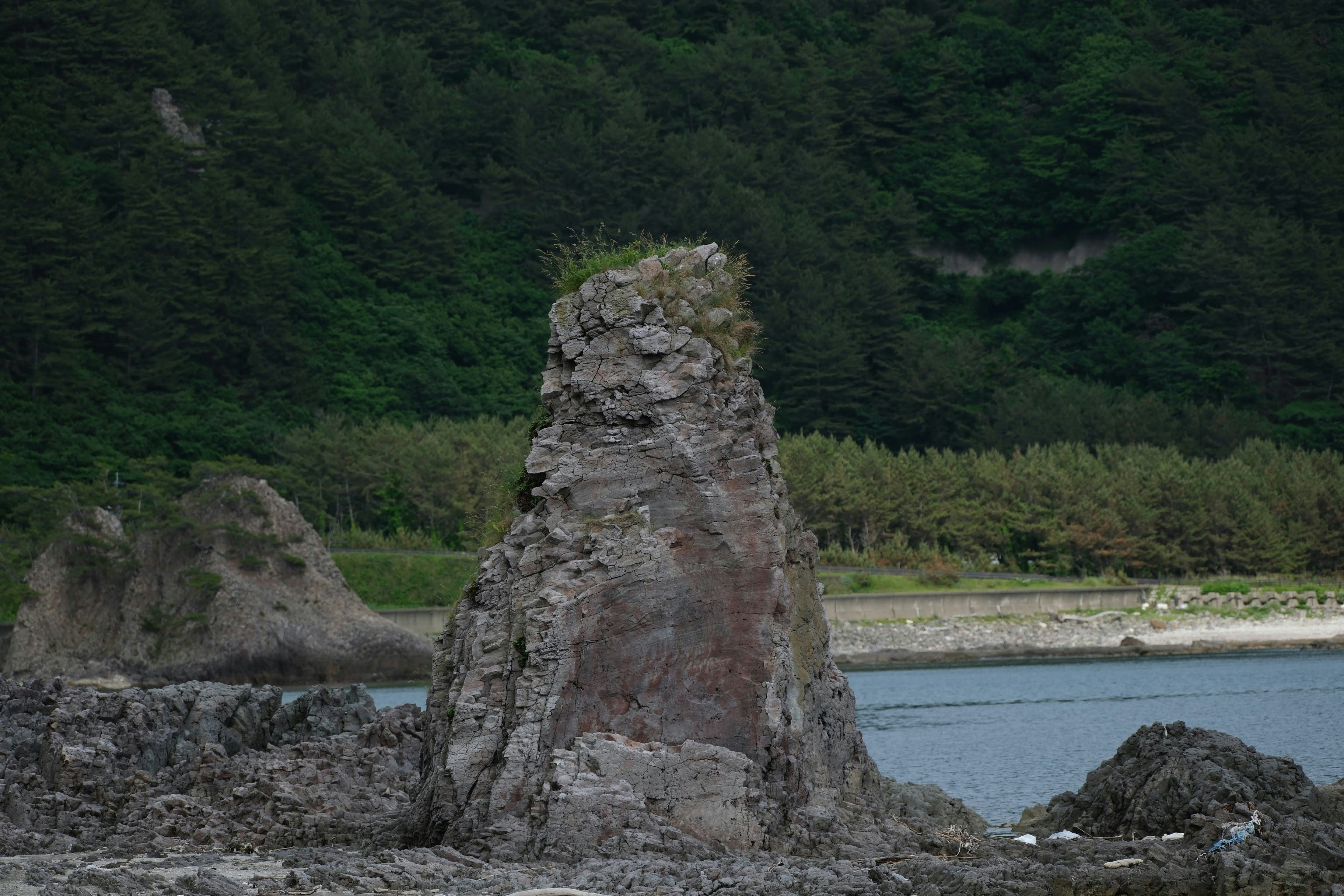 Castle of Stone: A solitary spire guarding a quiet inlet.