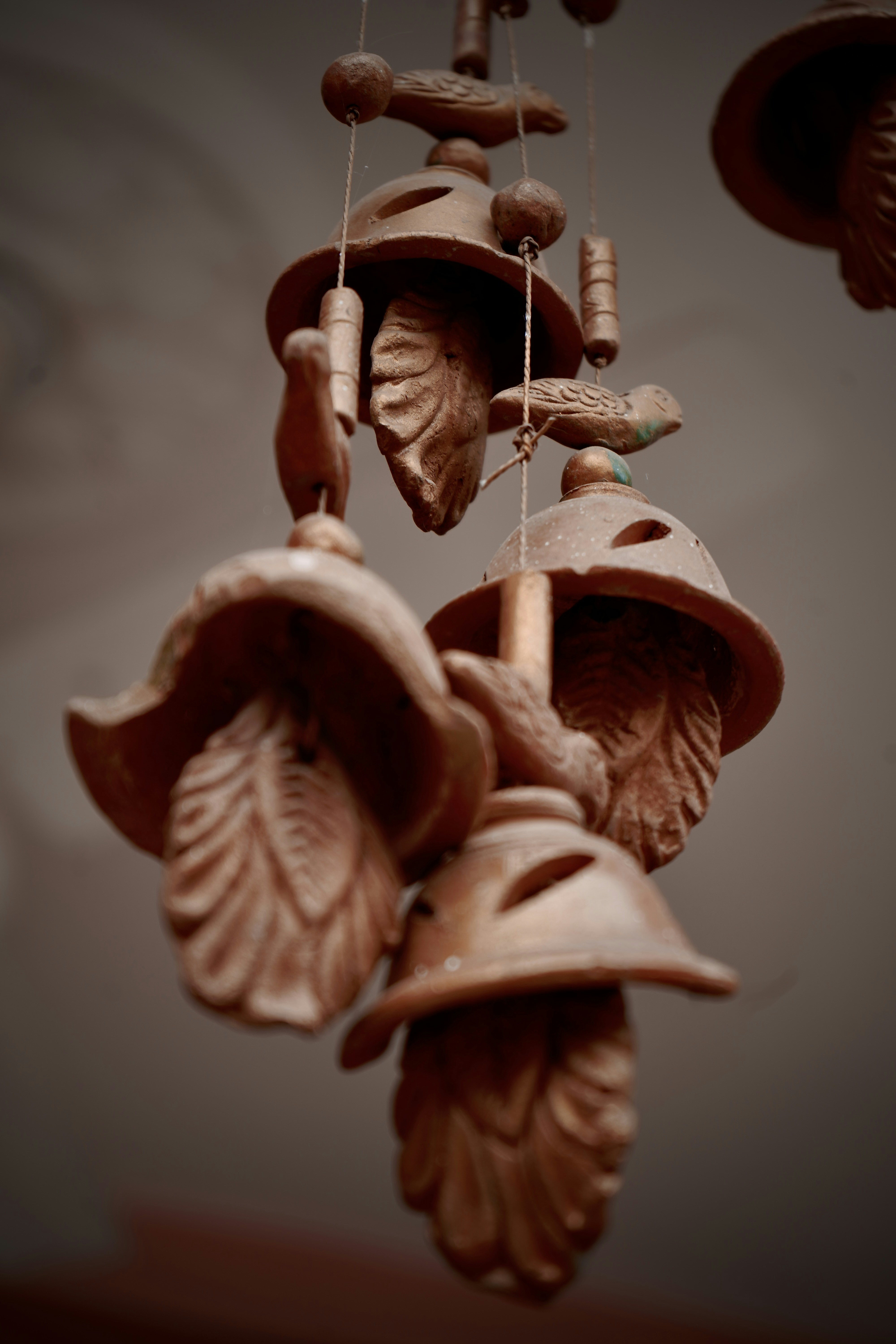 A group of bells hanging from a ceiling photo – Free India Image on ...