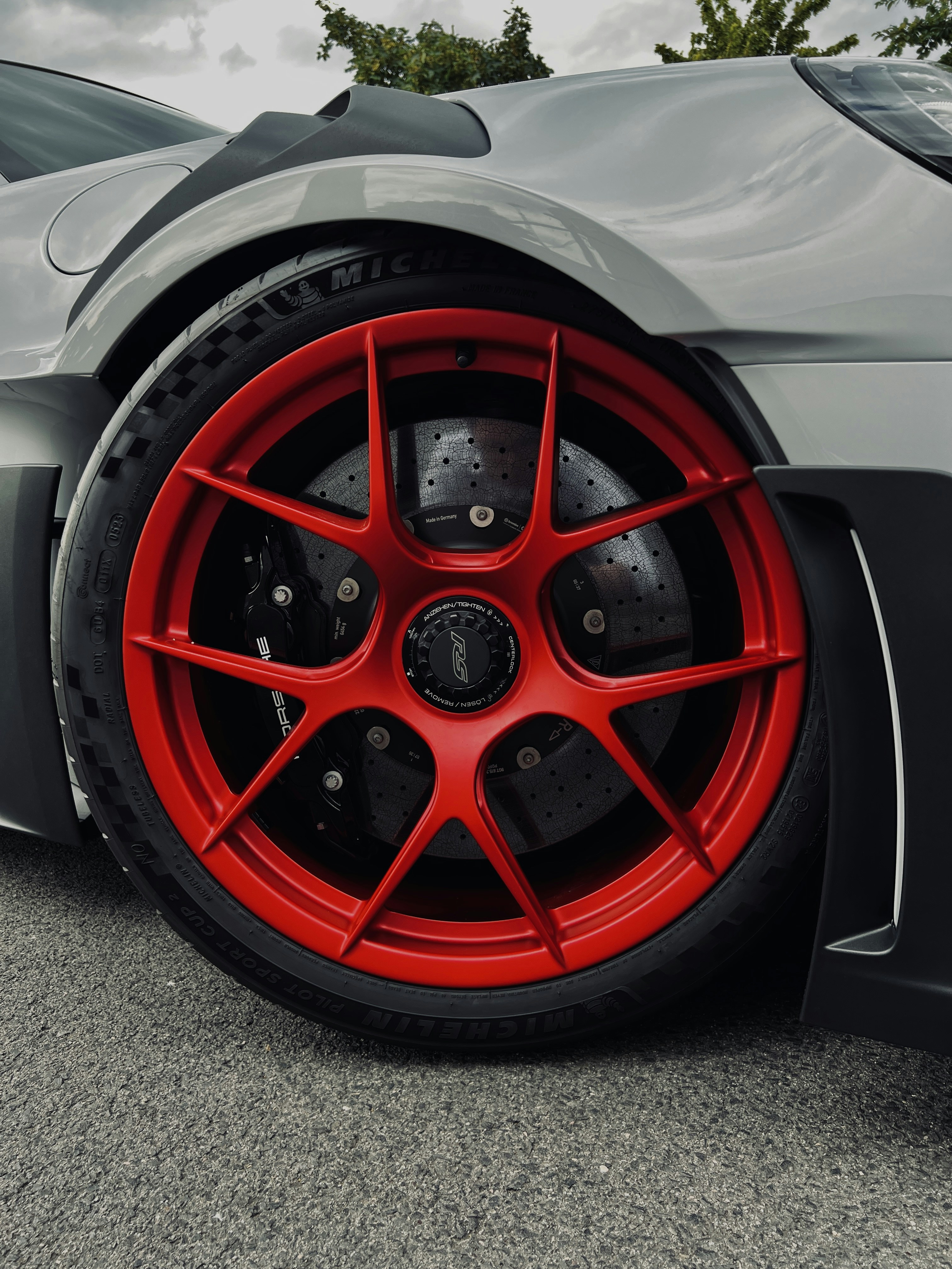 A close up of a red wheel on a sports car photo – Free Cars Image on ...