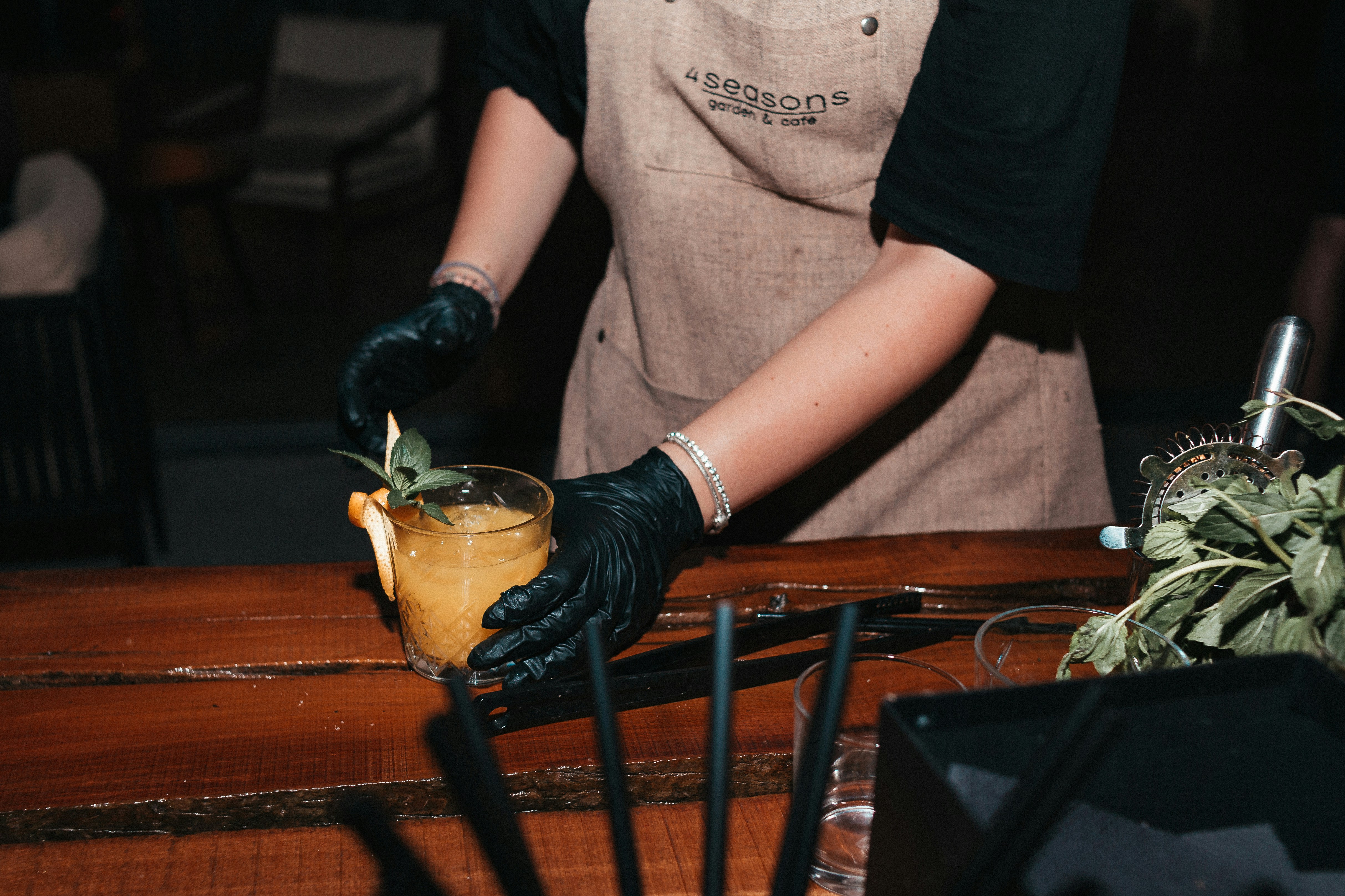 Amber Alchemy at Dusk: A Gloved Bartender's Craft