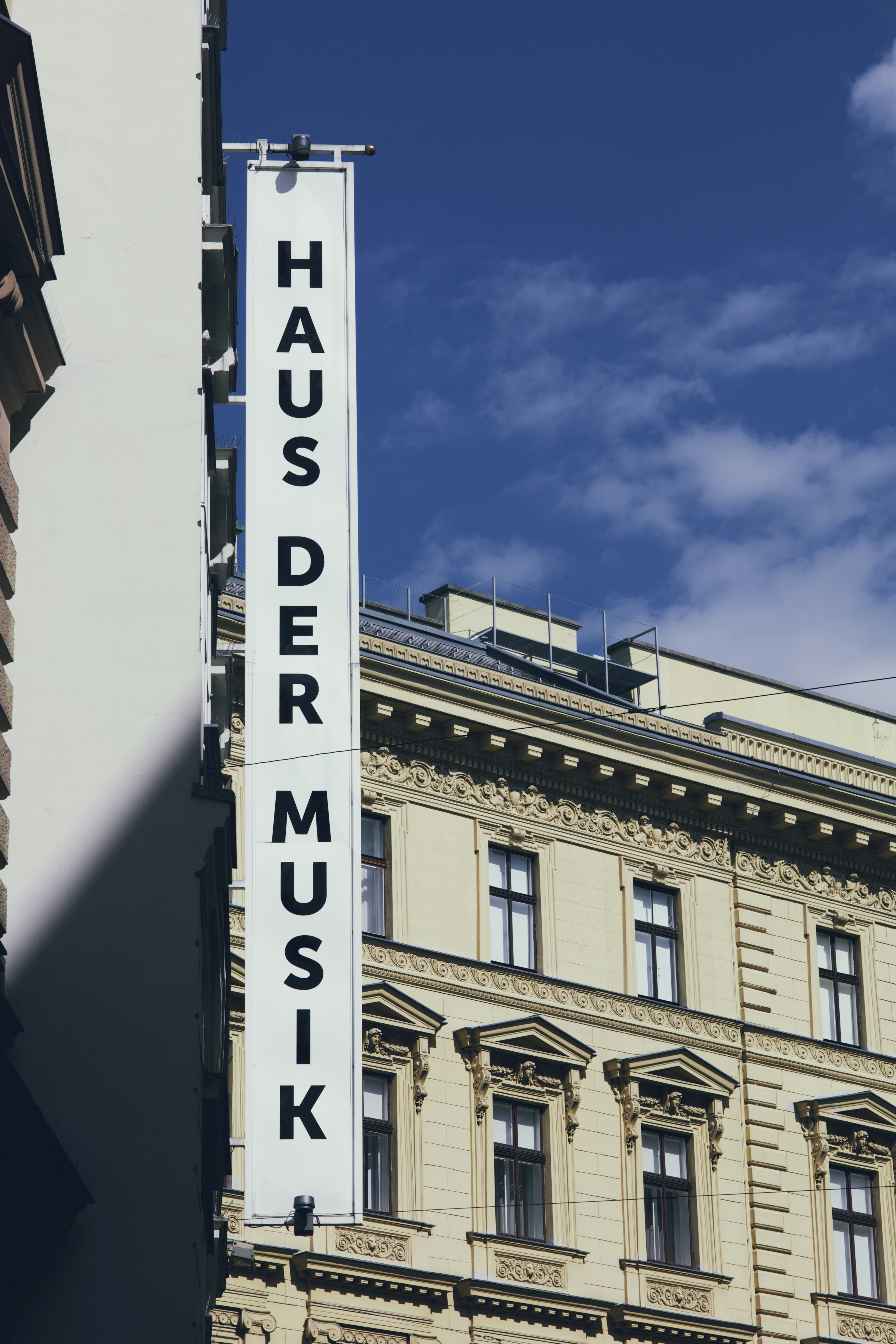 A sign that is on the side of a building photo – Free Vienna hdm Image ...