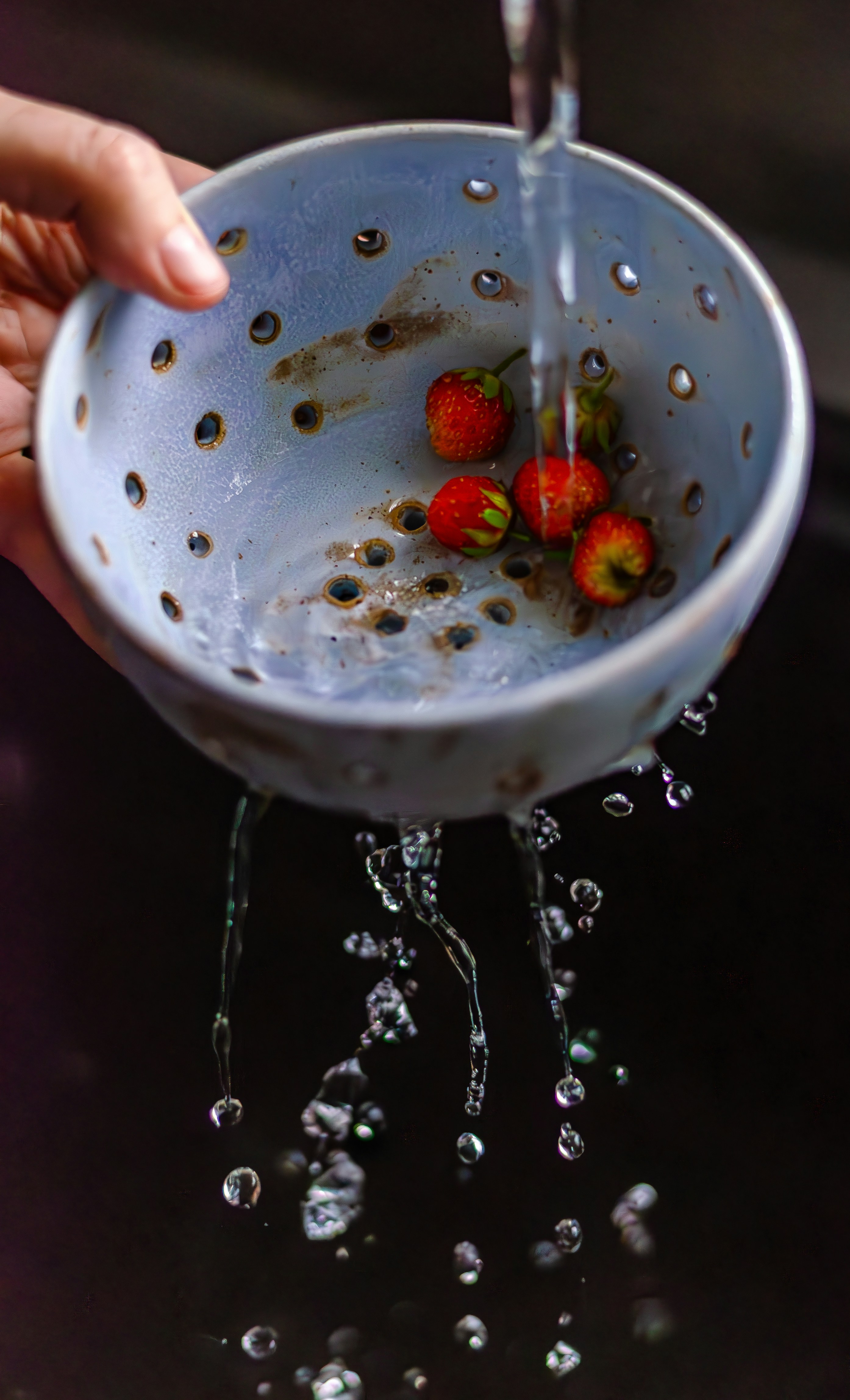 Blue Colander, Red Berries: a Whisper of Water in Focus