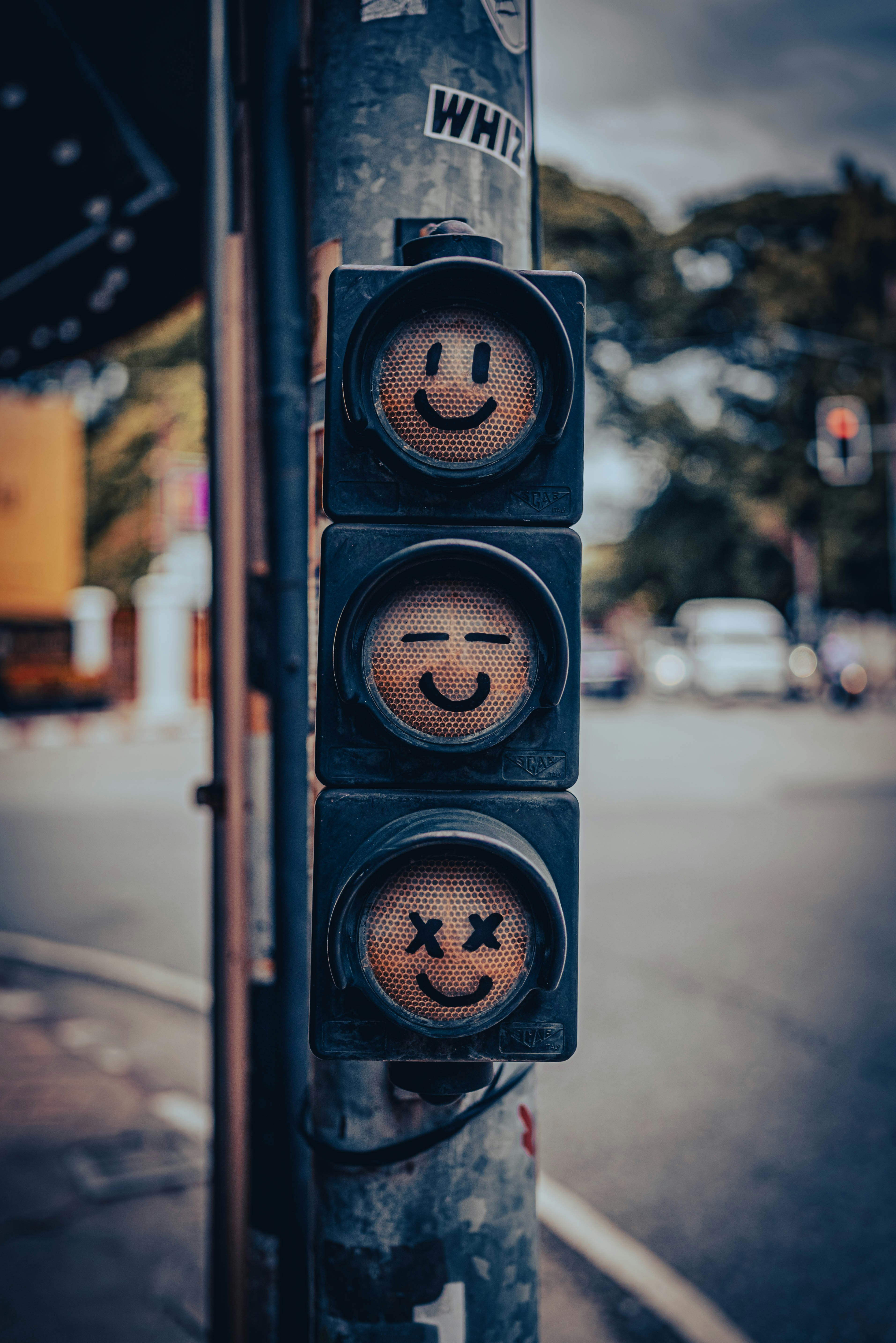 A traffic light with two smiley faces on it photo – Free Street Image ...