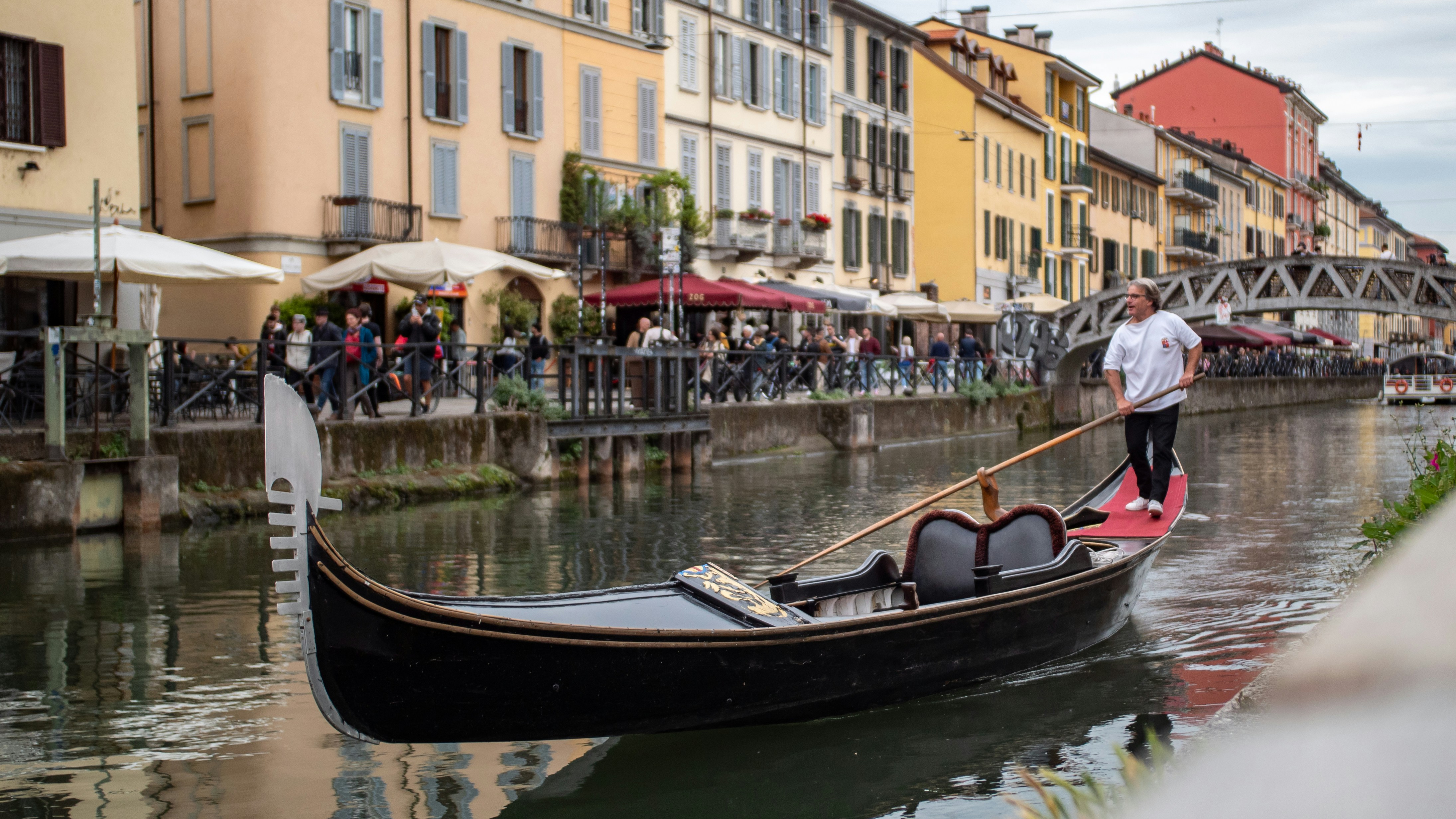 Gondola Drift Along a Lively Italian Canal