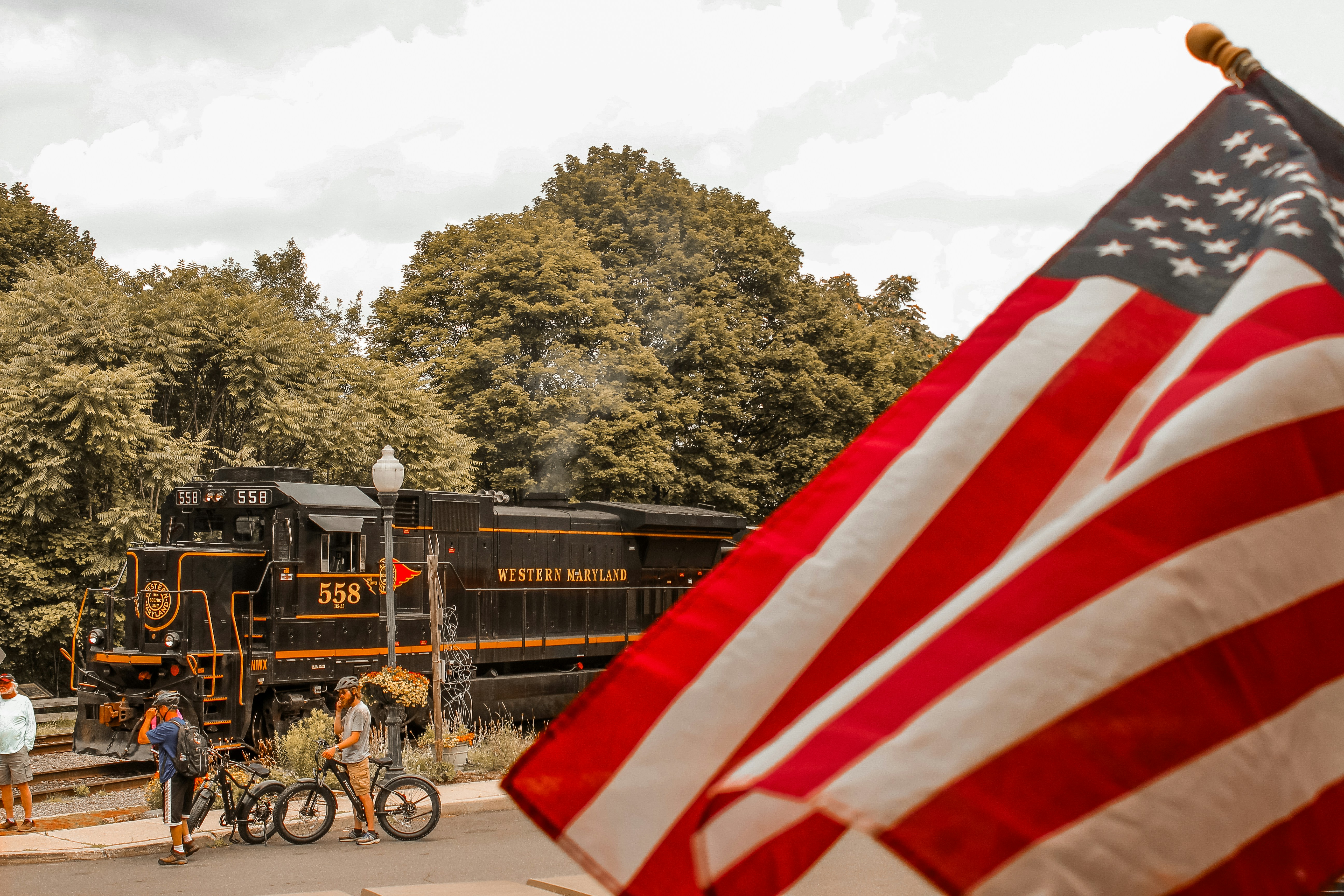 A flag and a train on a train track photo – Free Frostburg Image on ...