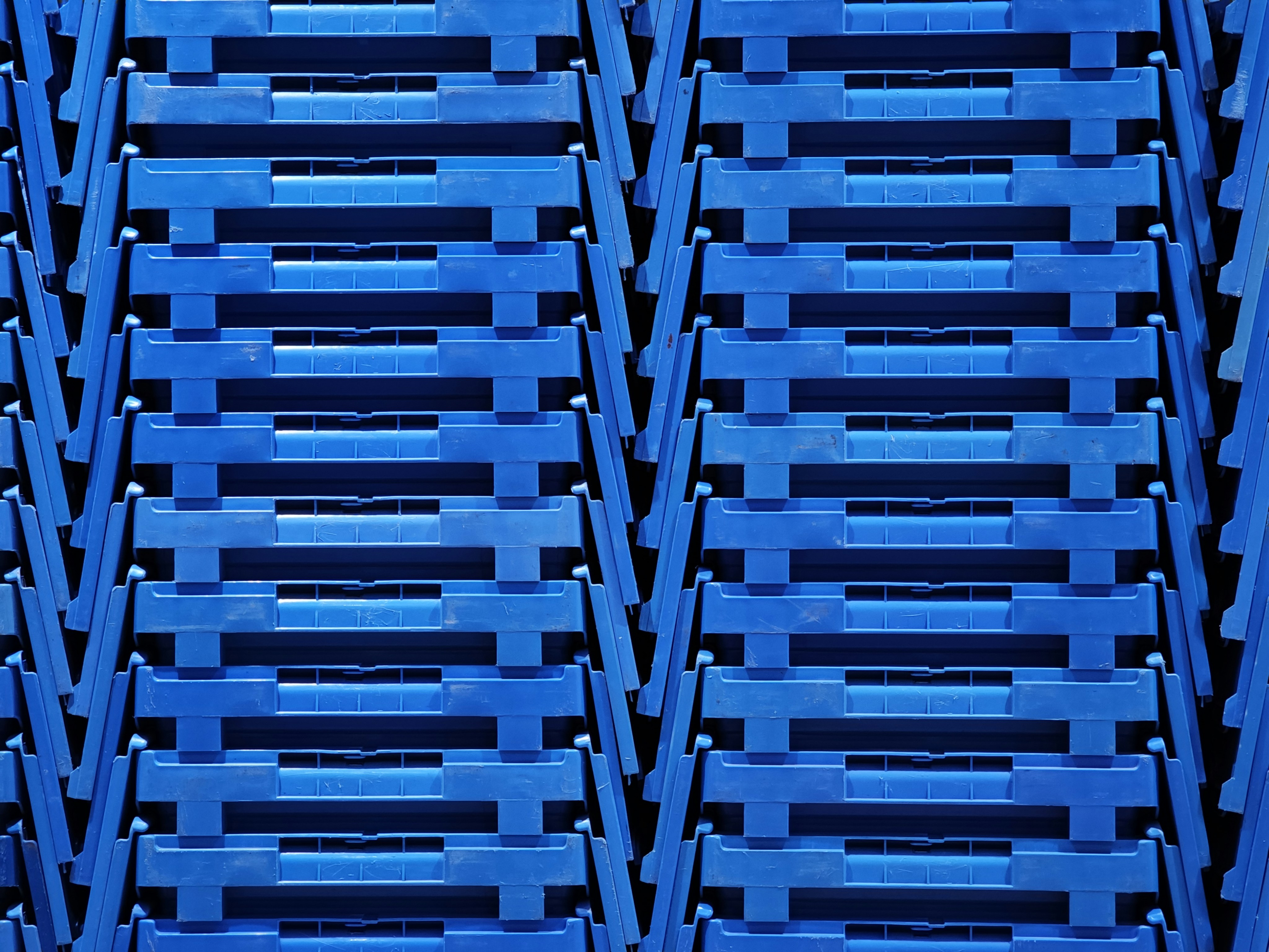 A large stack of blue crates stacked on top of each other photo – Free ...