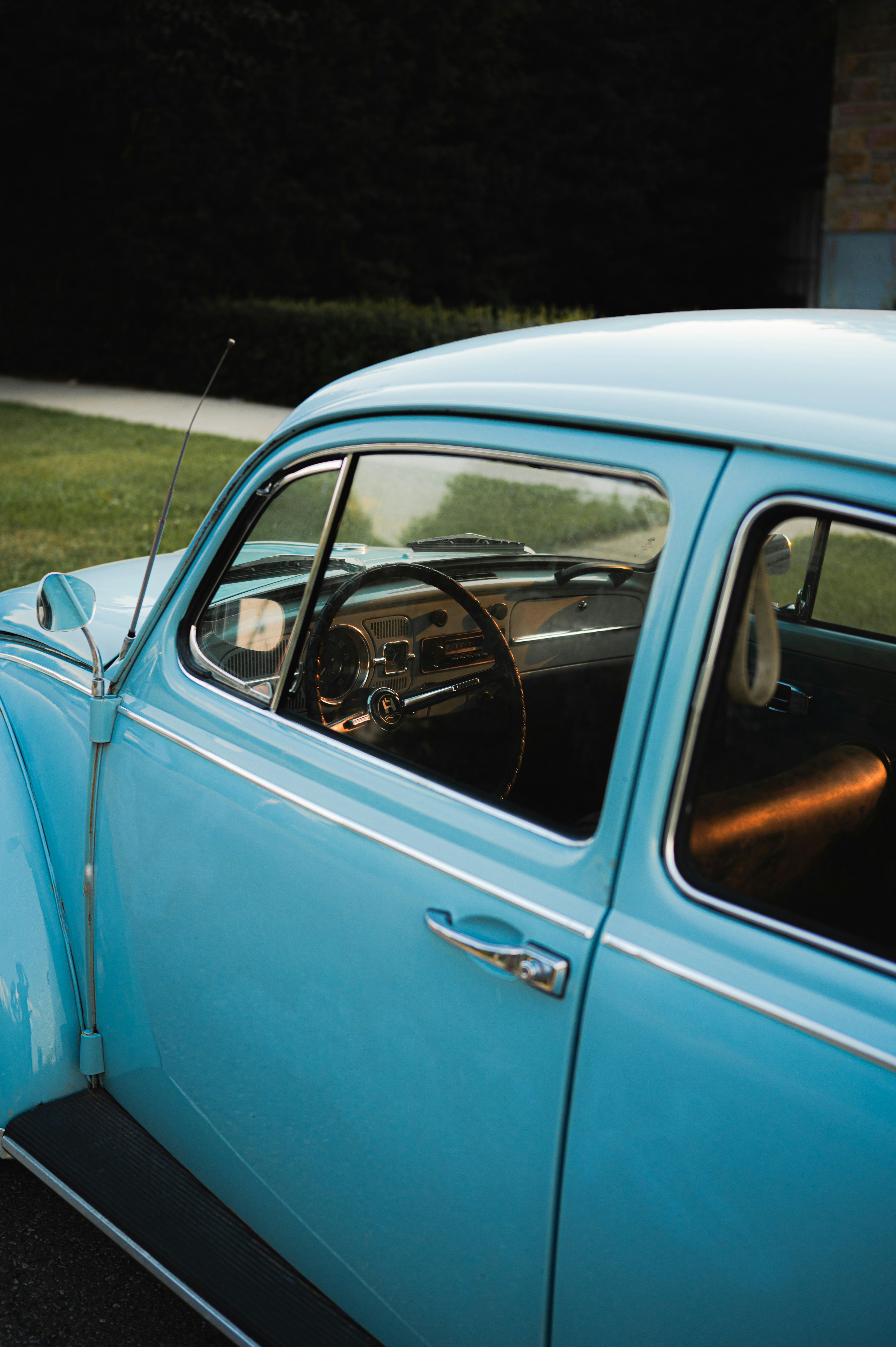 A blue car parked on the side of the road photo – Free Car Image on ...