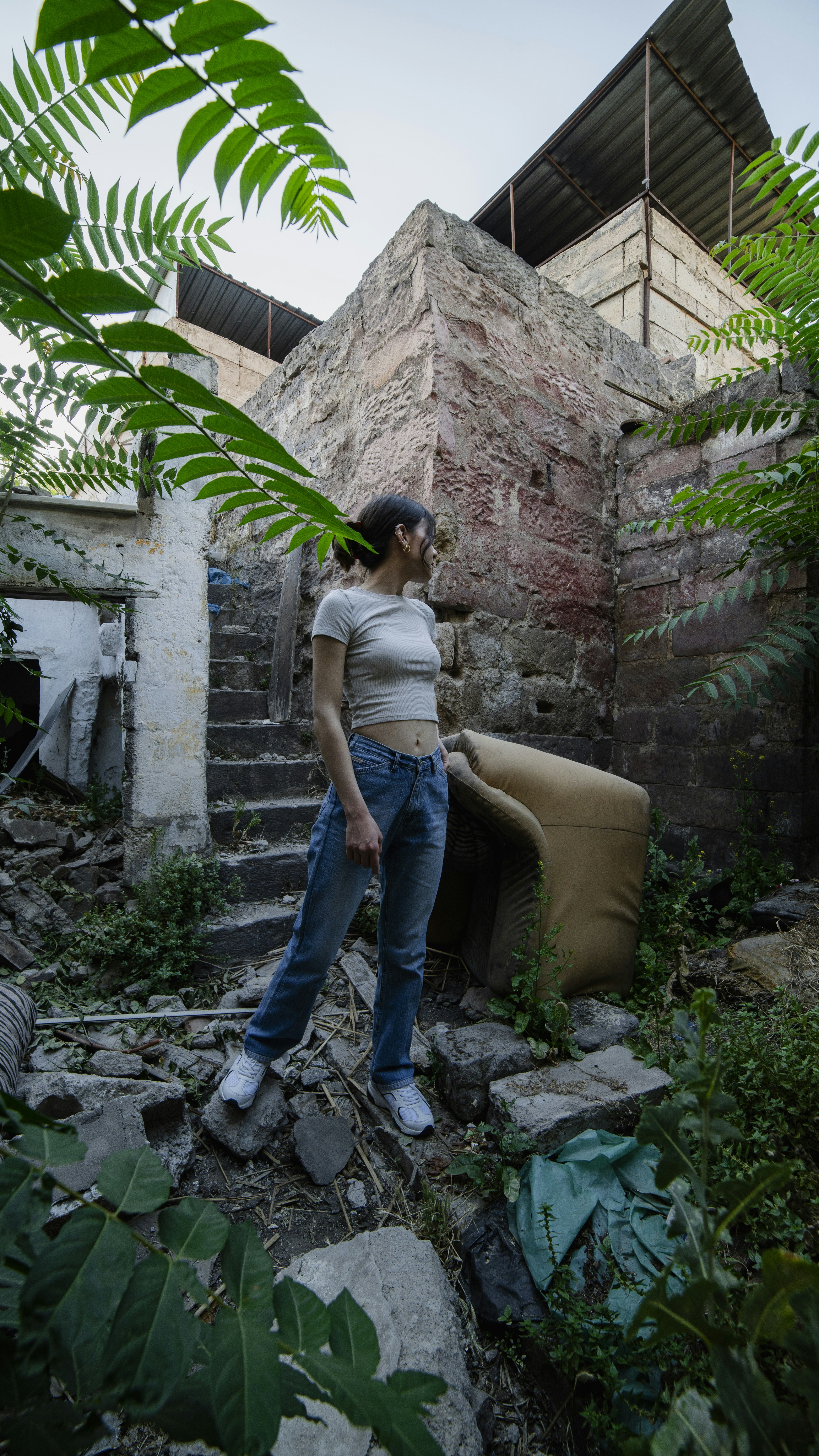 Fern-Framed Portrait in a Crumbling Courtyard