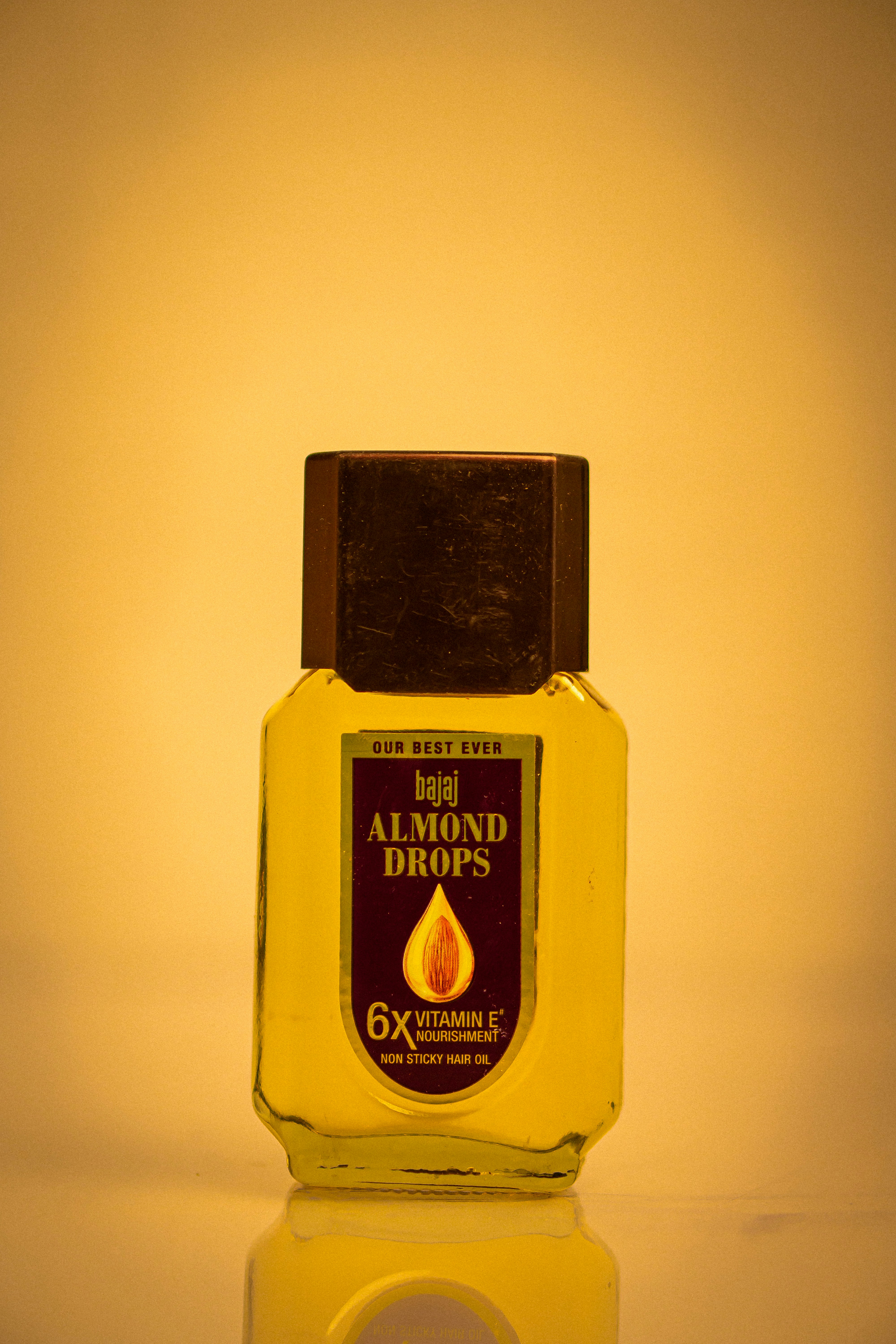 Golden Core: A Micro Portrait of Bajaj Almond Drops Hair Oil Bottle