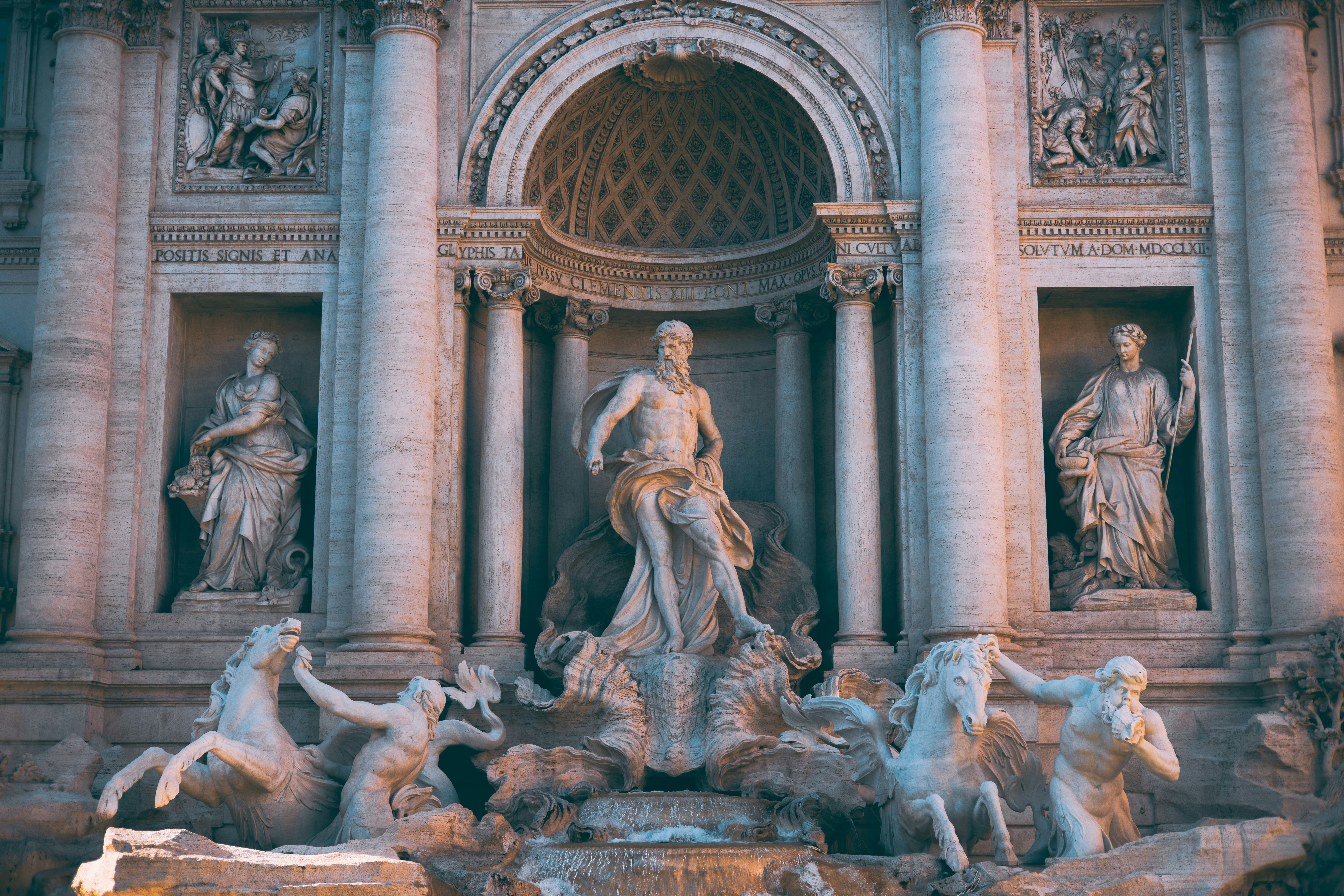 A statue of a woman surrounded by other statues photo – Free Trevi ...