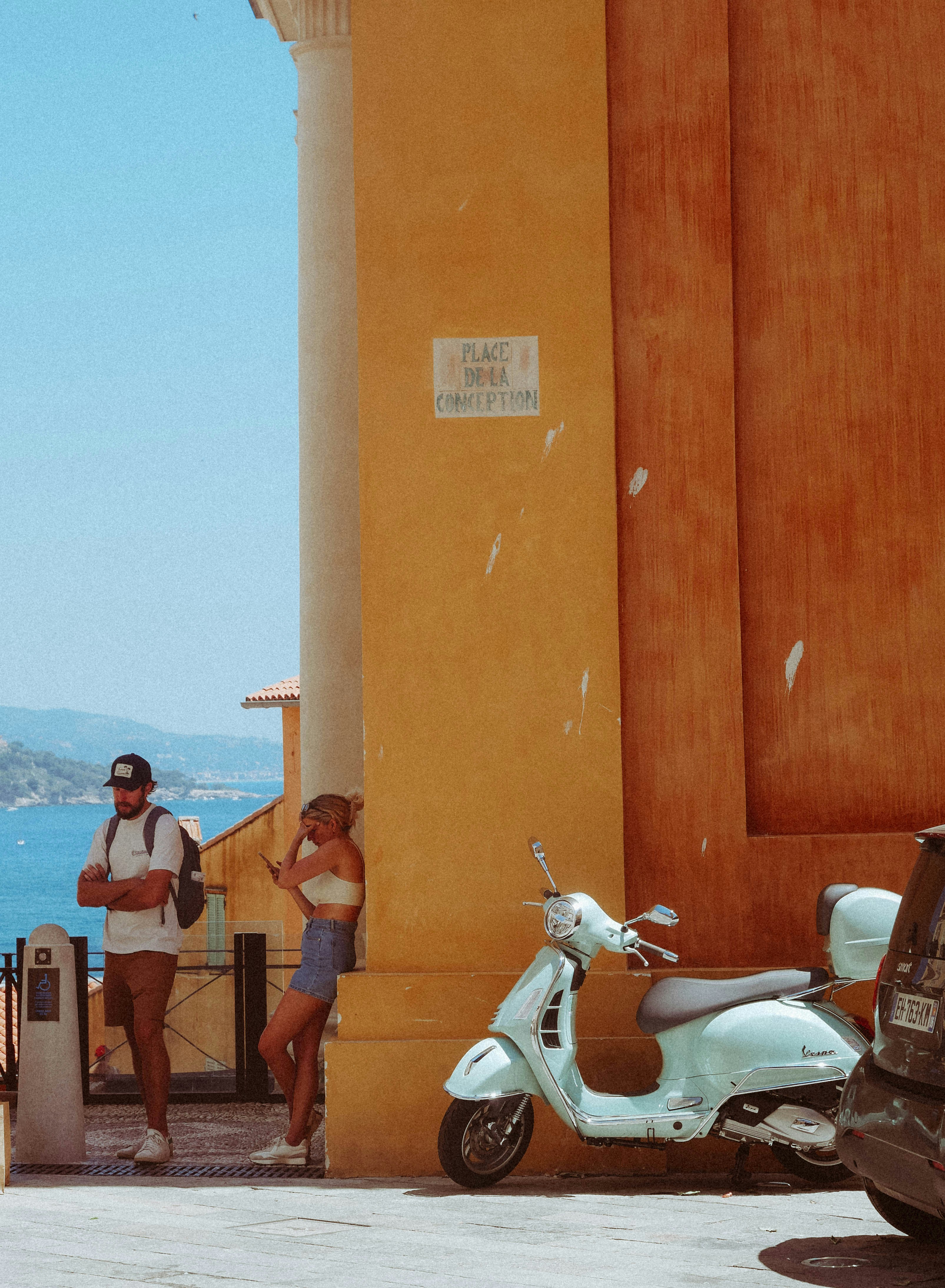 Sunlit Terrace by the Harbor: A Scooter, Porto and People in Warm Spain-like Light
