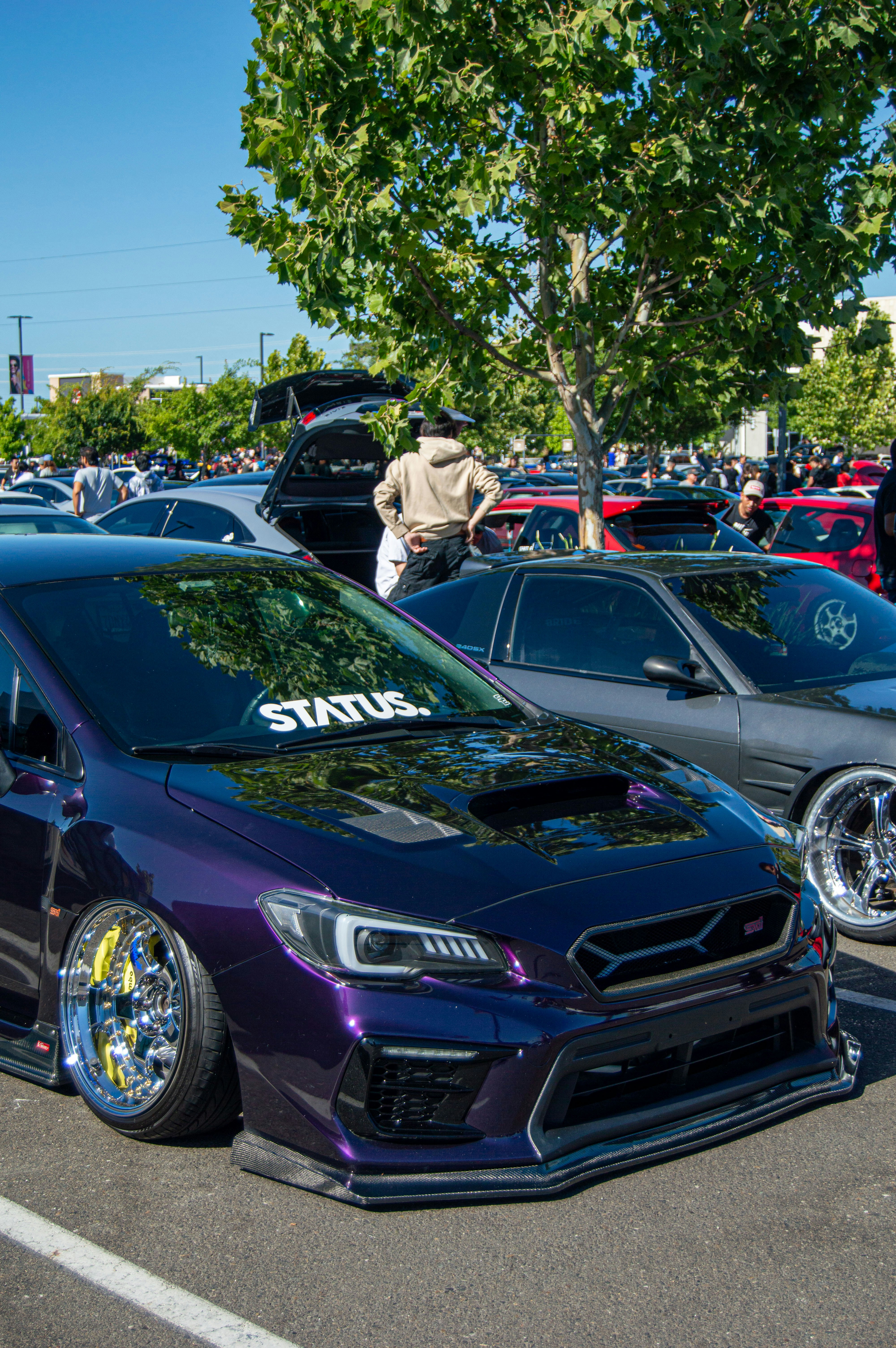Glossy blue beast at idle: a car show centerpiece with chrome accents