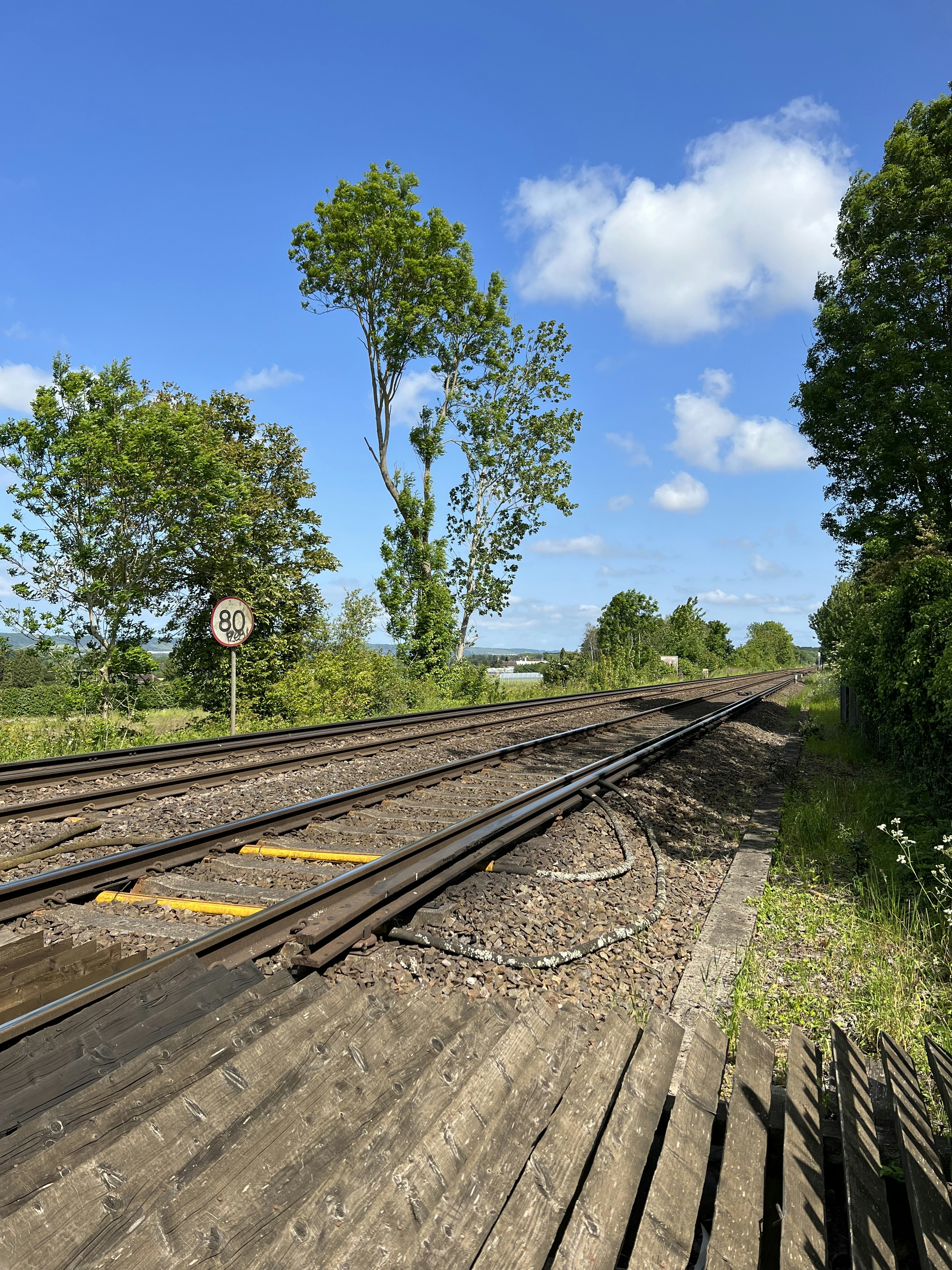 A train track with a stop sign in the distance photo – Free East ...