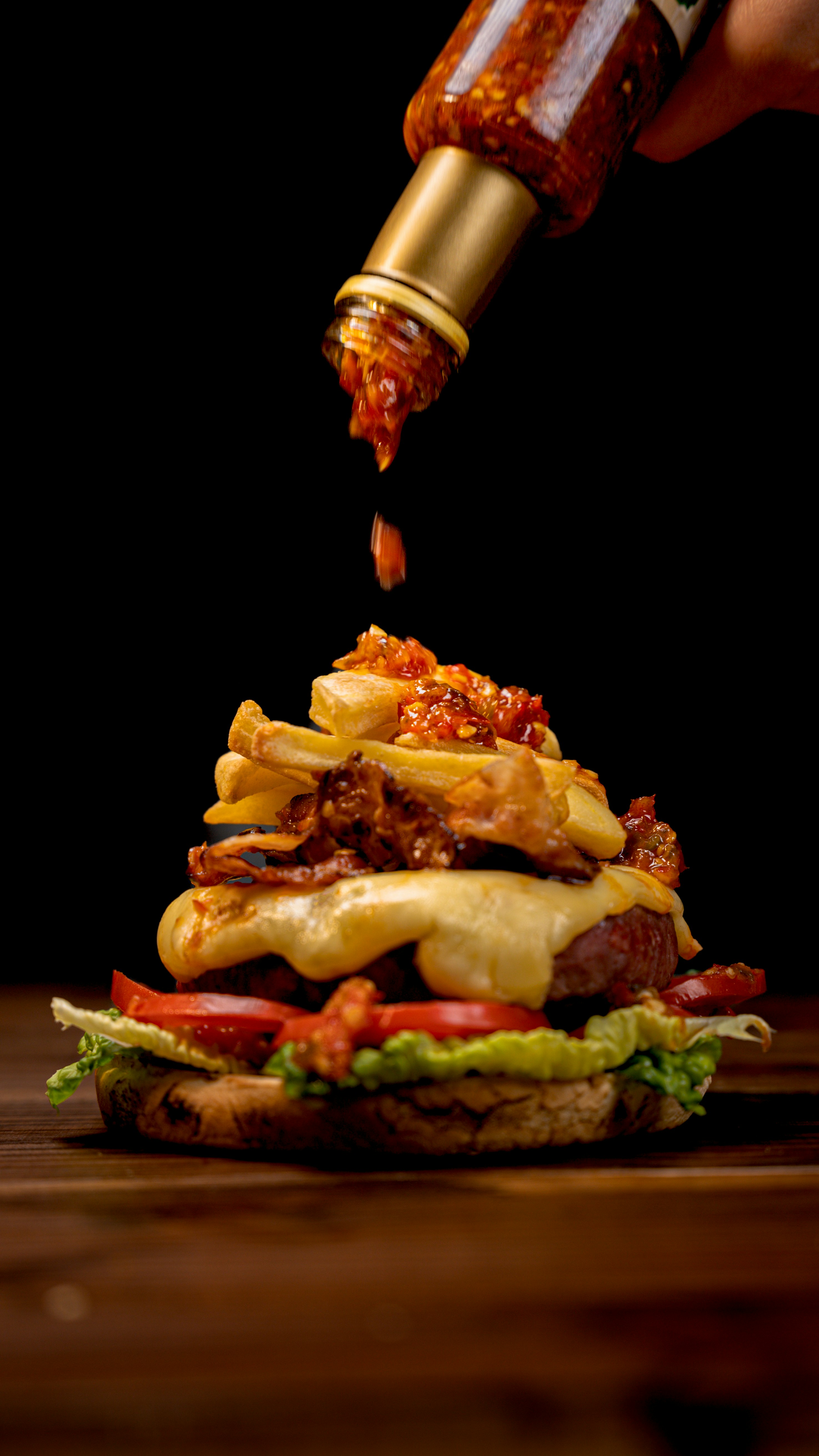 Drip Crown: A Saucy Pour Tops a Towering Cheeseburger