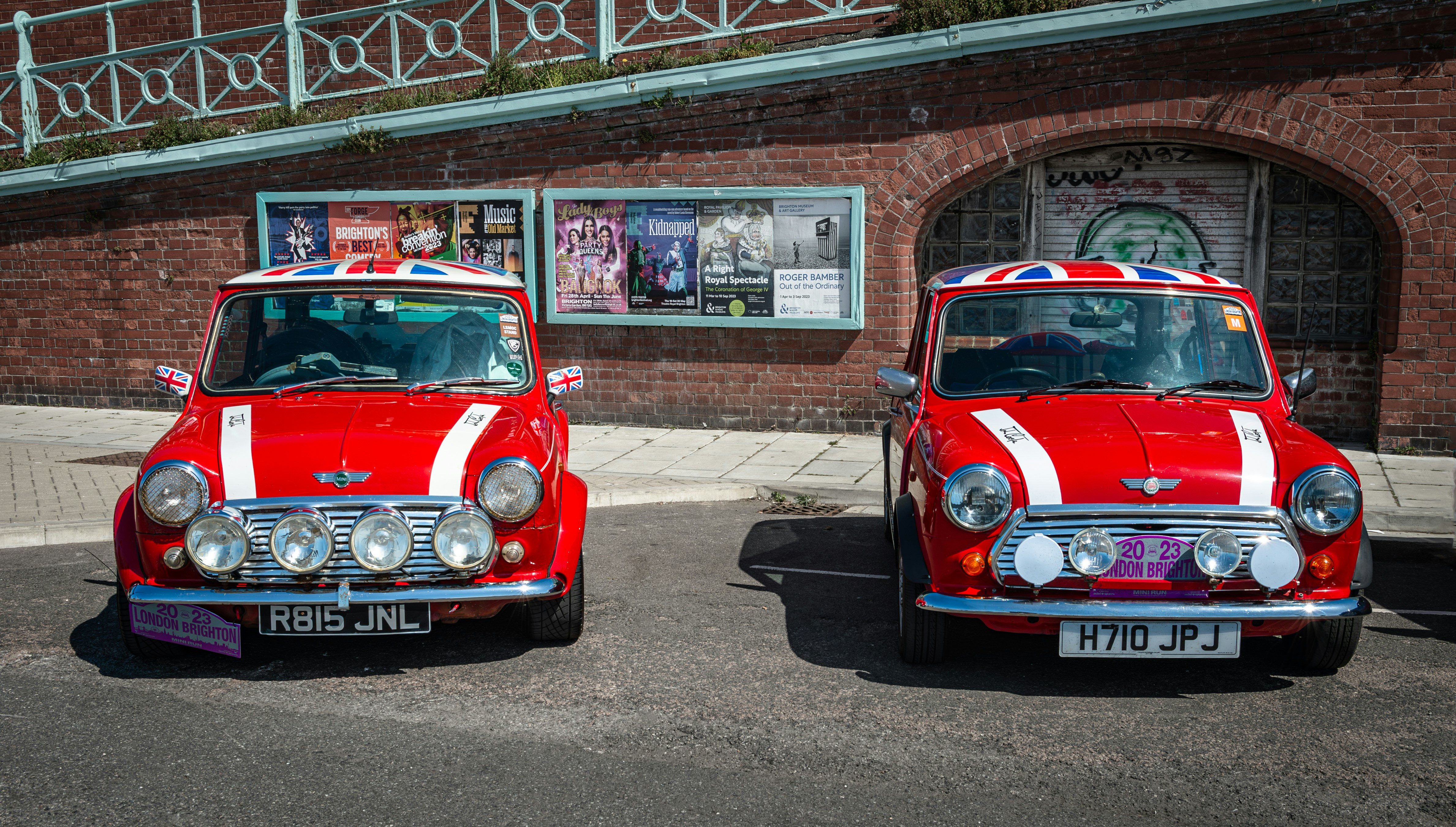 A couple of red and white cars parked next to each other photo – Free ...