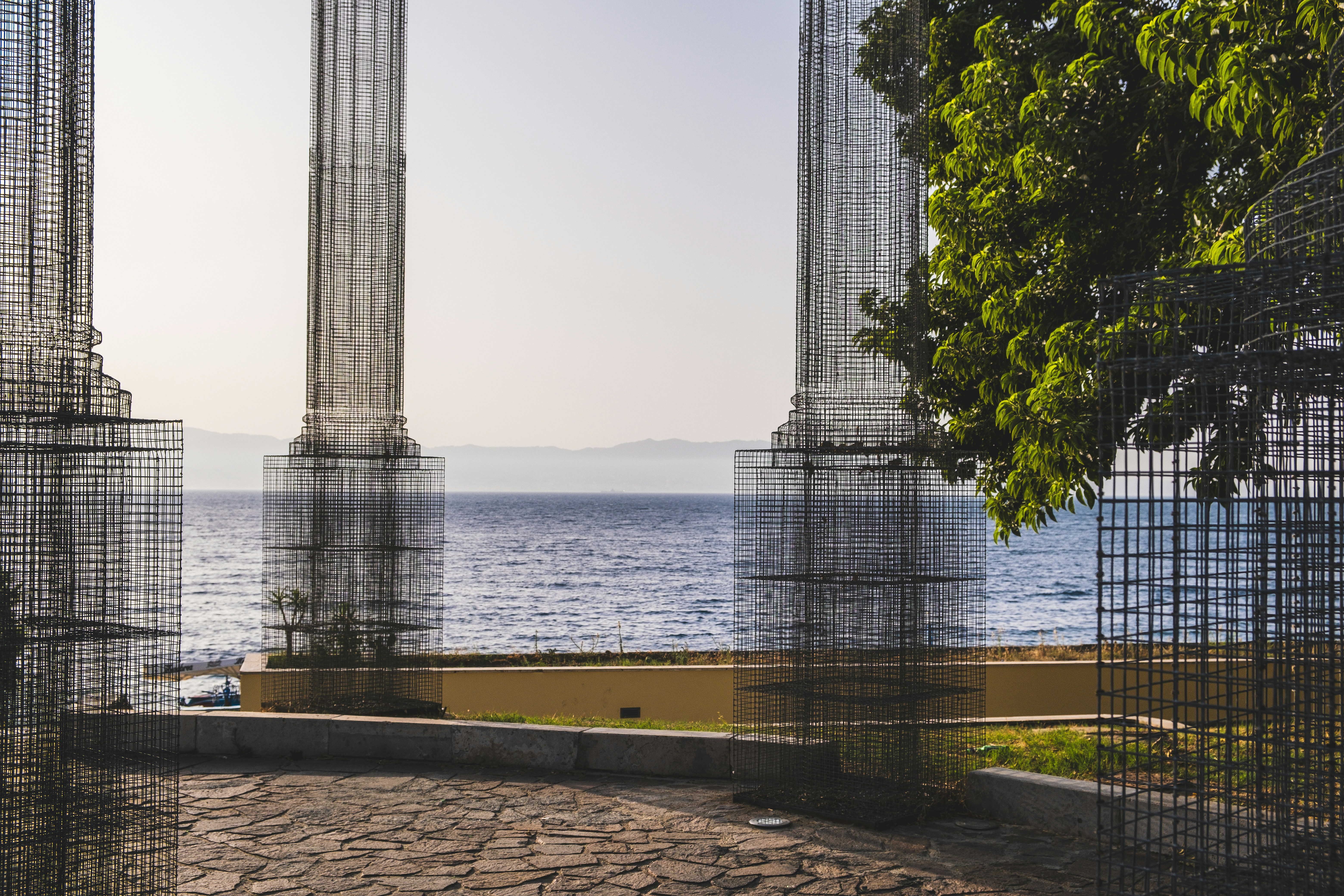 Sunlit Sea and Steel: Construction Frames by the Shore
