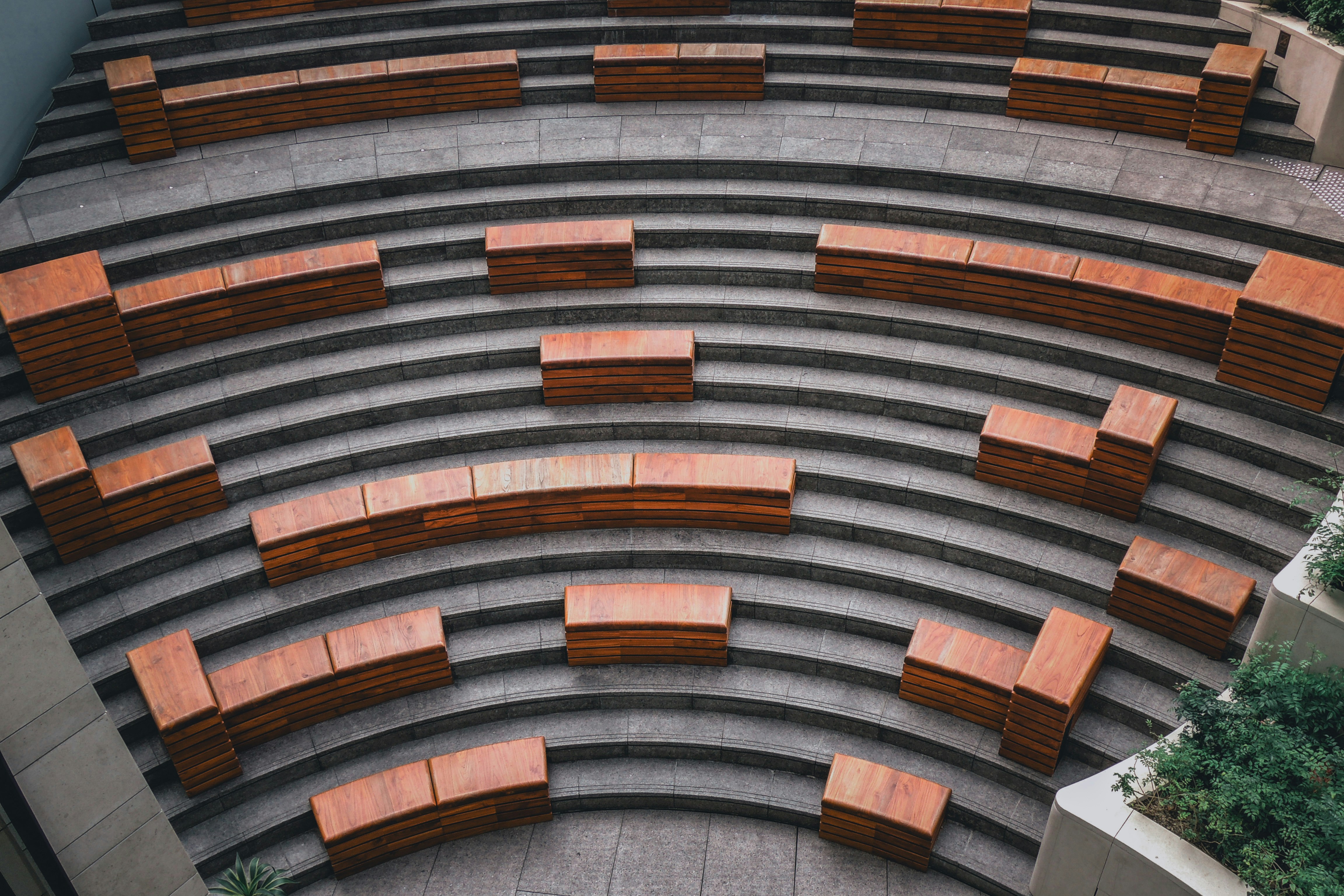 Concentric Terrace: Wooden Benches Adorning a Sunken Amphitheater