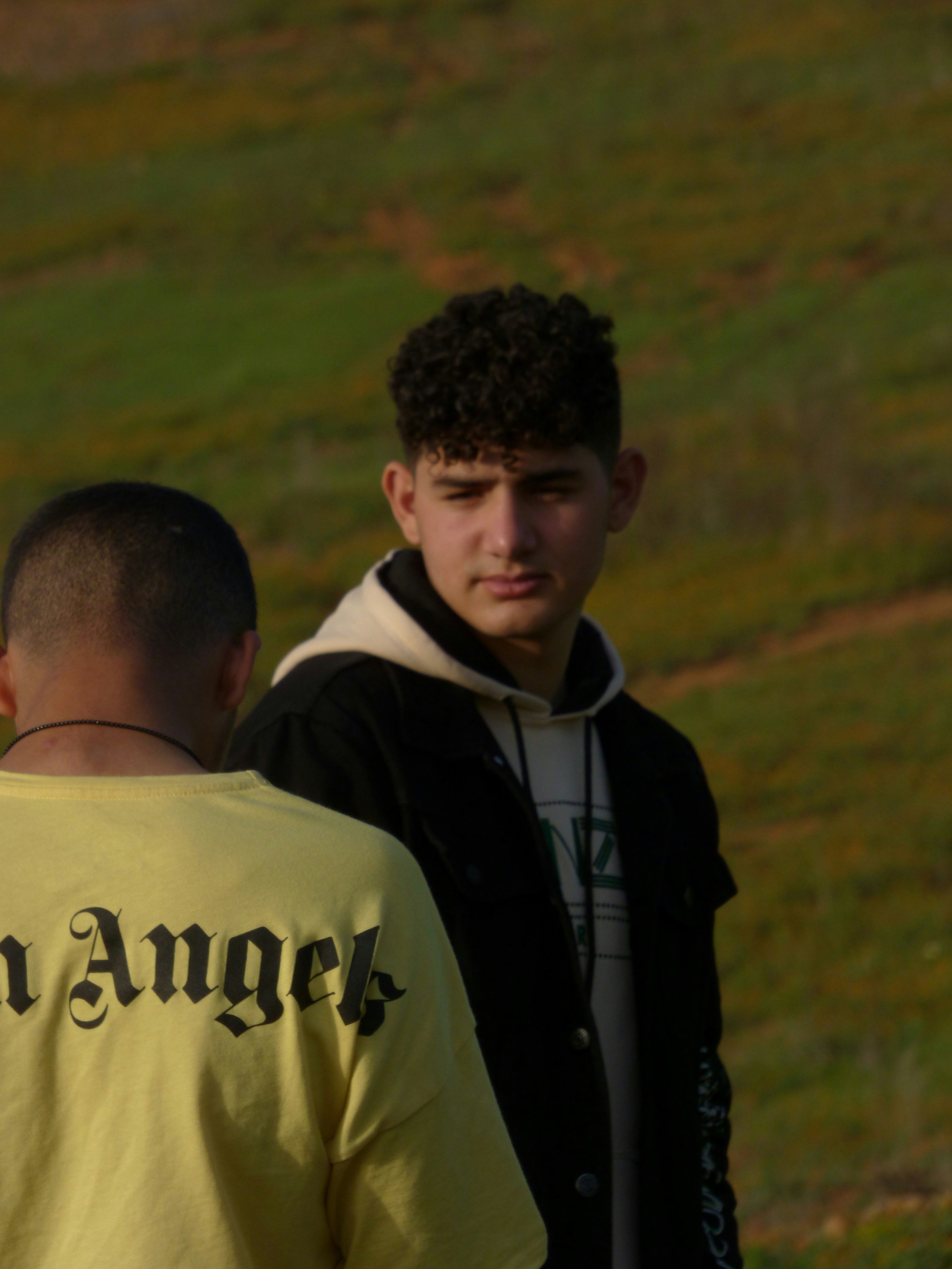 Two young men standing next to each other photo – Free Portrait Image ...