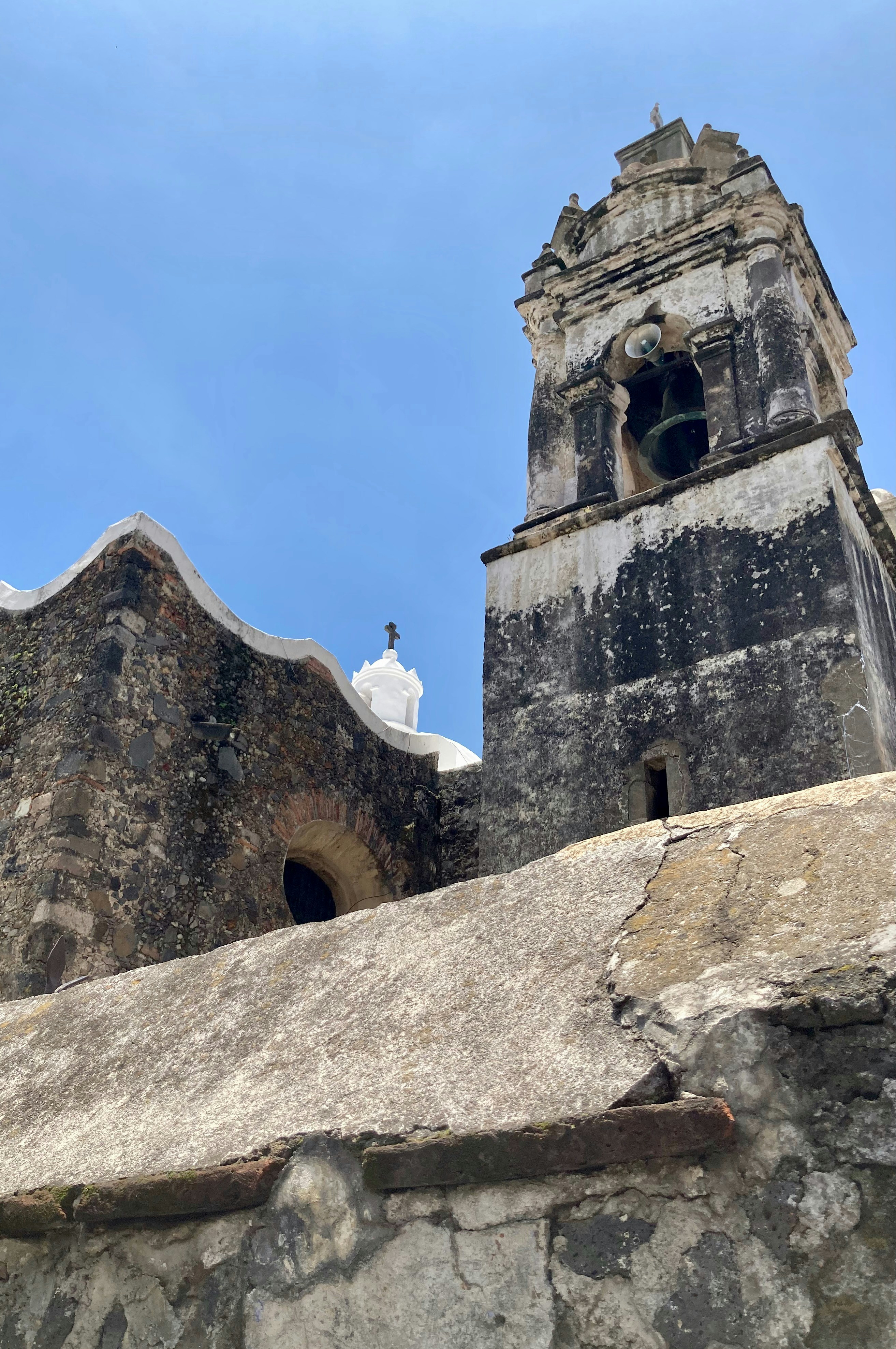 Weathered Bell Tower Reaching Toward a Cerulean Sky