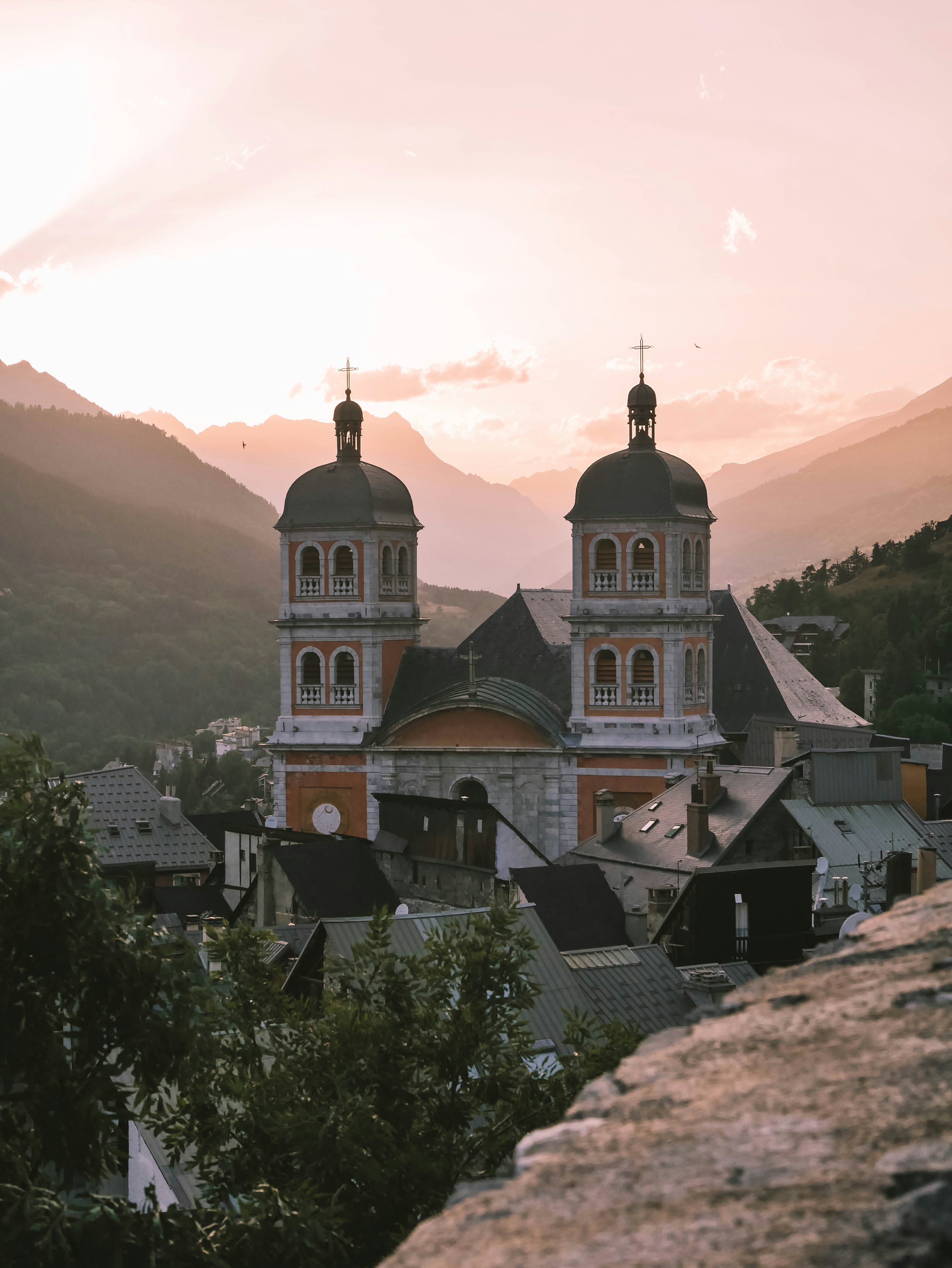 Dusk on Twin Domes: Alpine Chapel Framed by Sunset Valleys