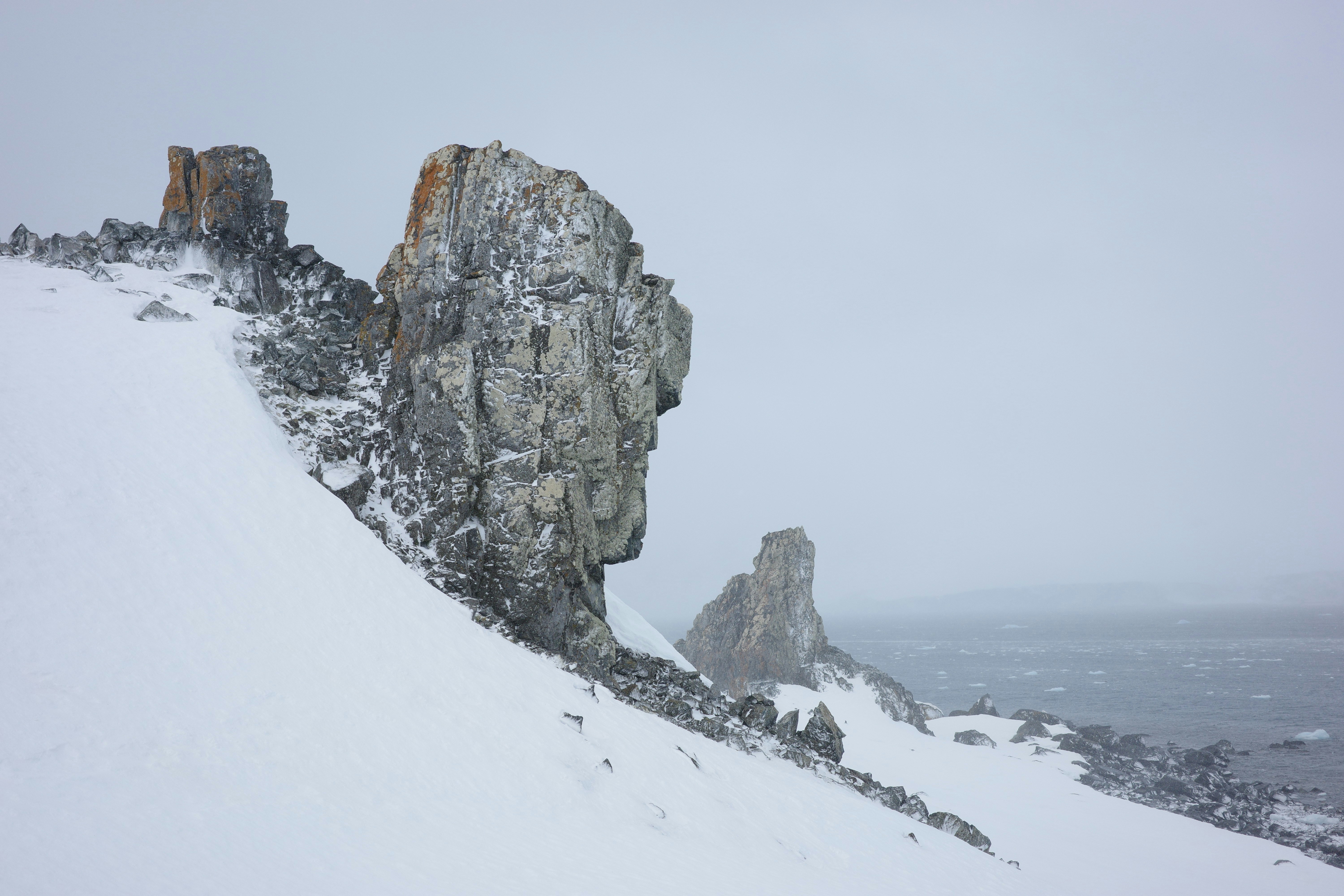 Snowbound Promontory: Granite Reach Toward a Distant Sea