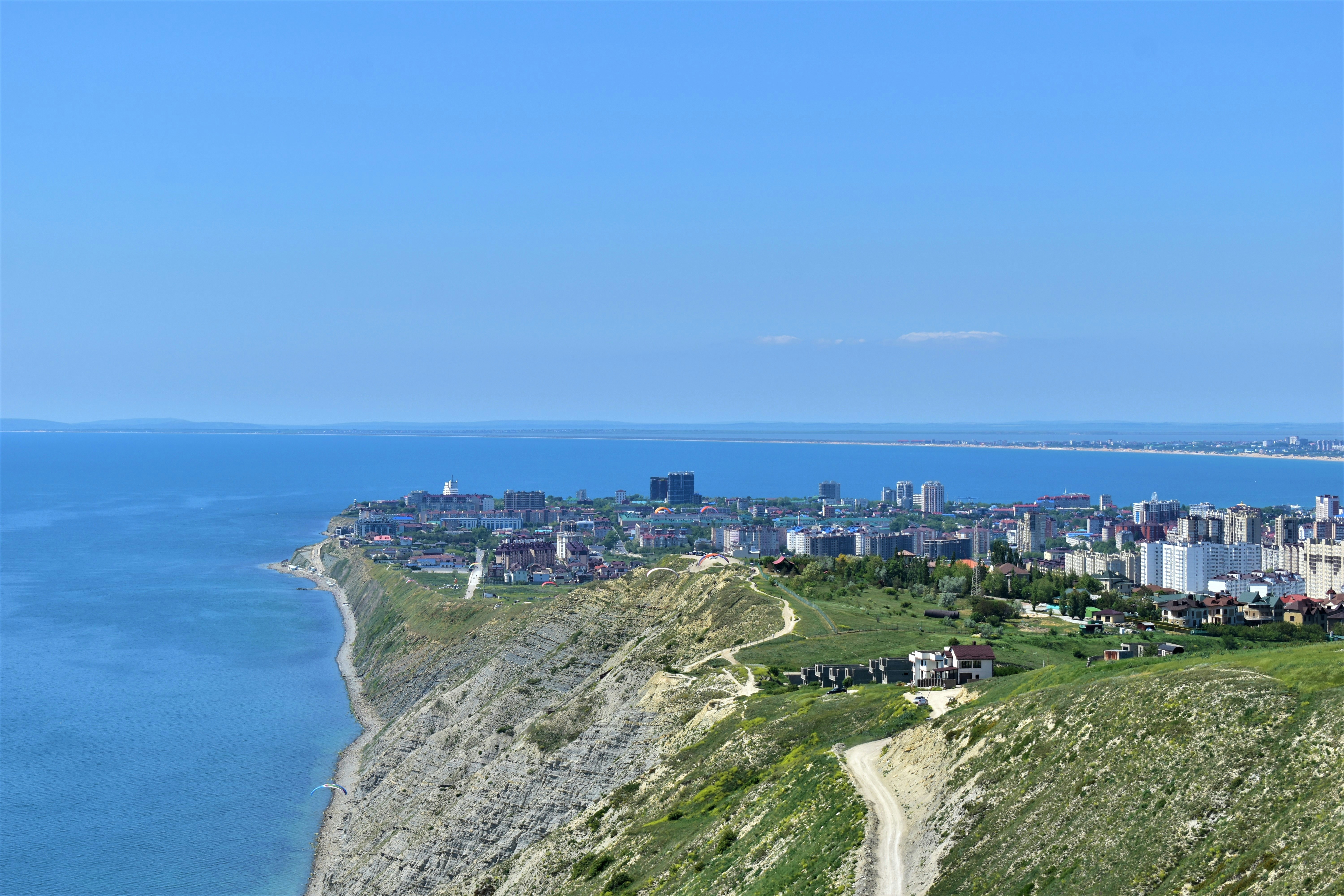 A scenic view of a city on the edge of a cliff photo – Free Anapa Image ...