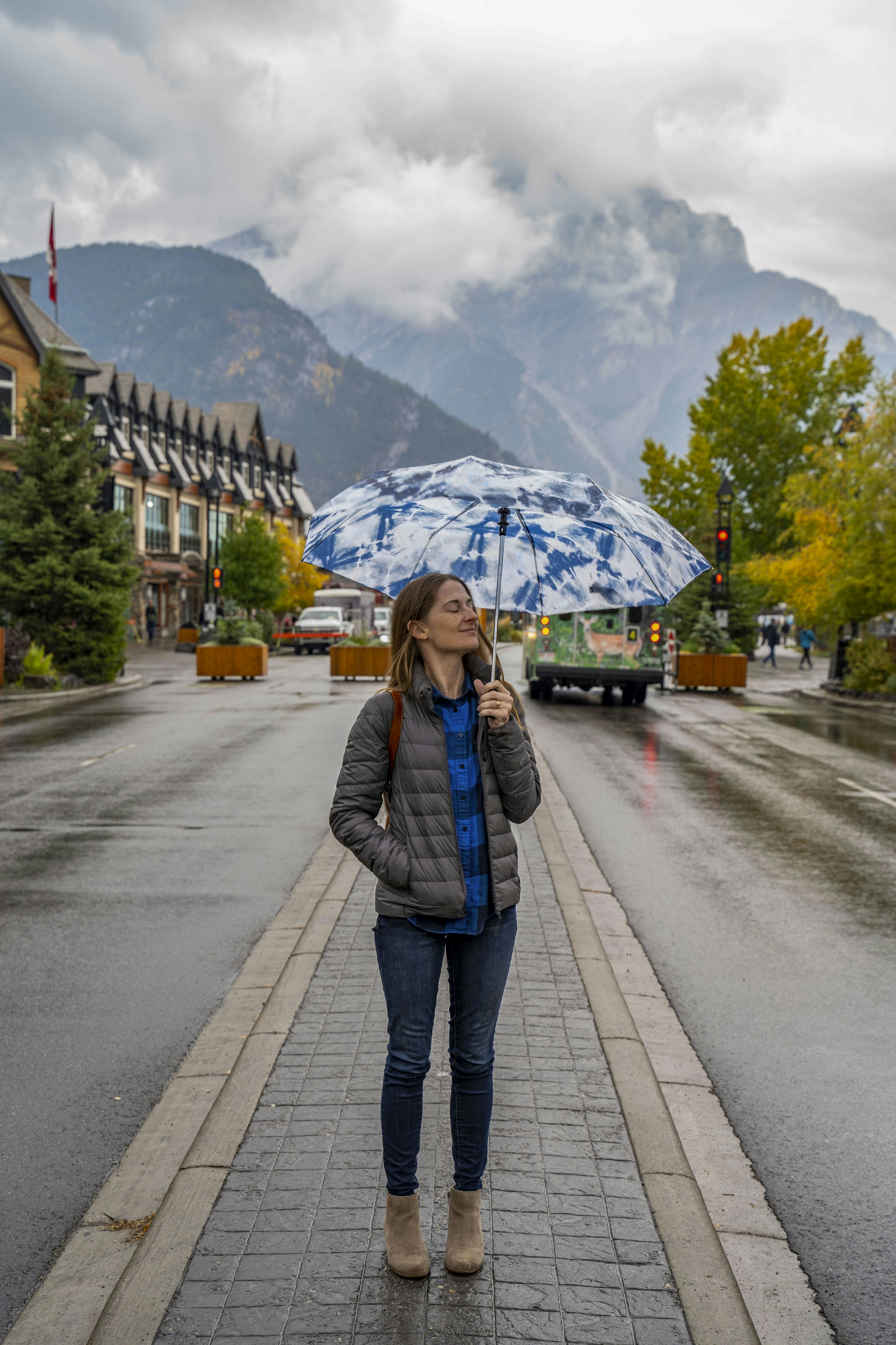 Umbrella Moment on a Rain-Slick Mountain Town Street