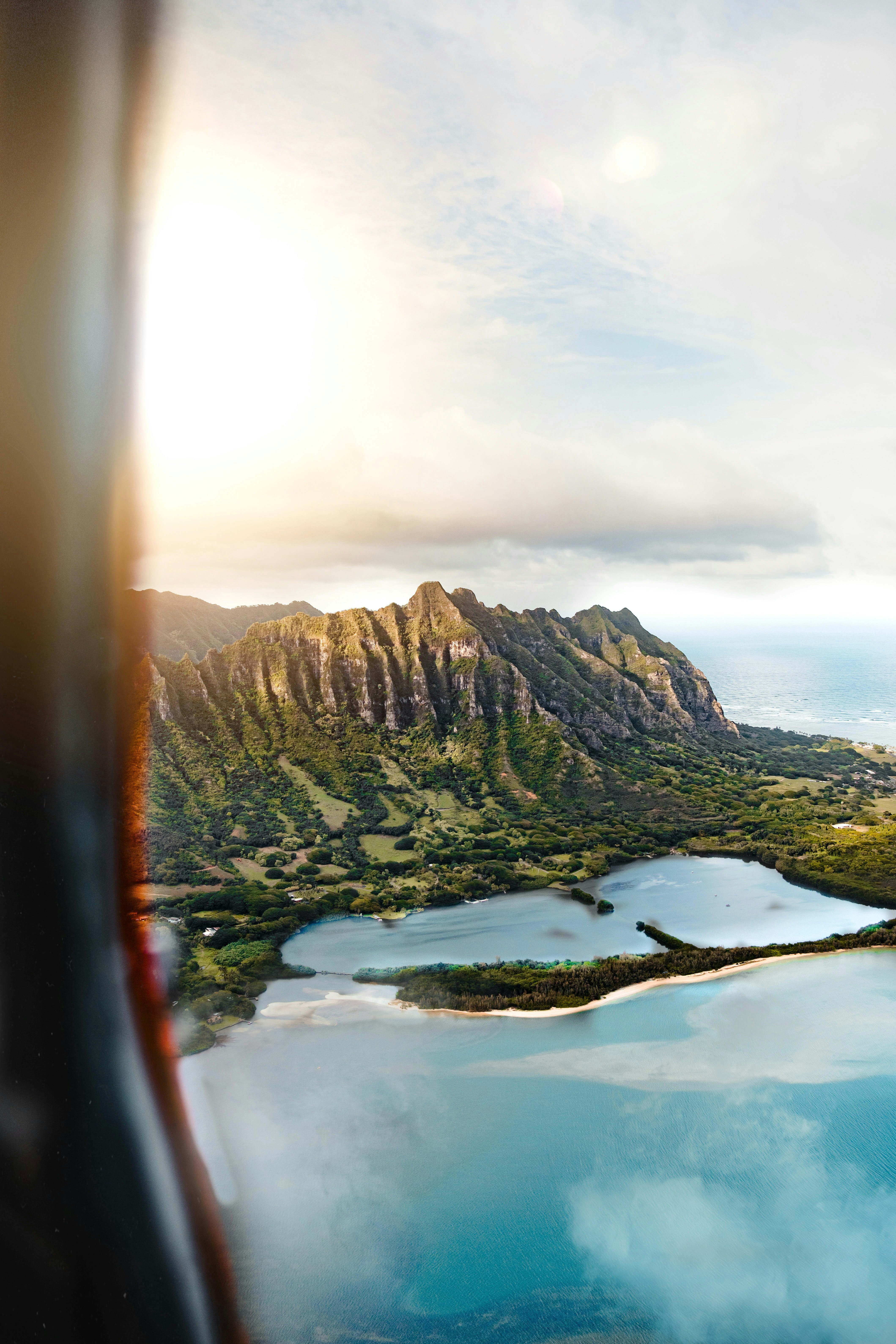 A view of a lake and mountains from an airplane photo – Free Oahu Image ...